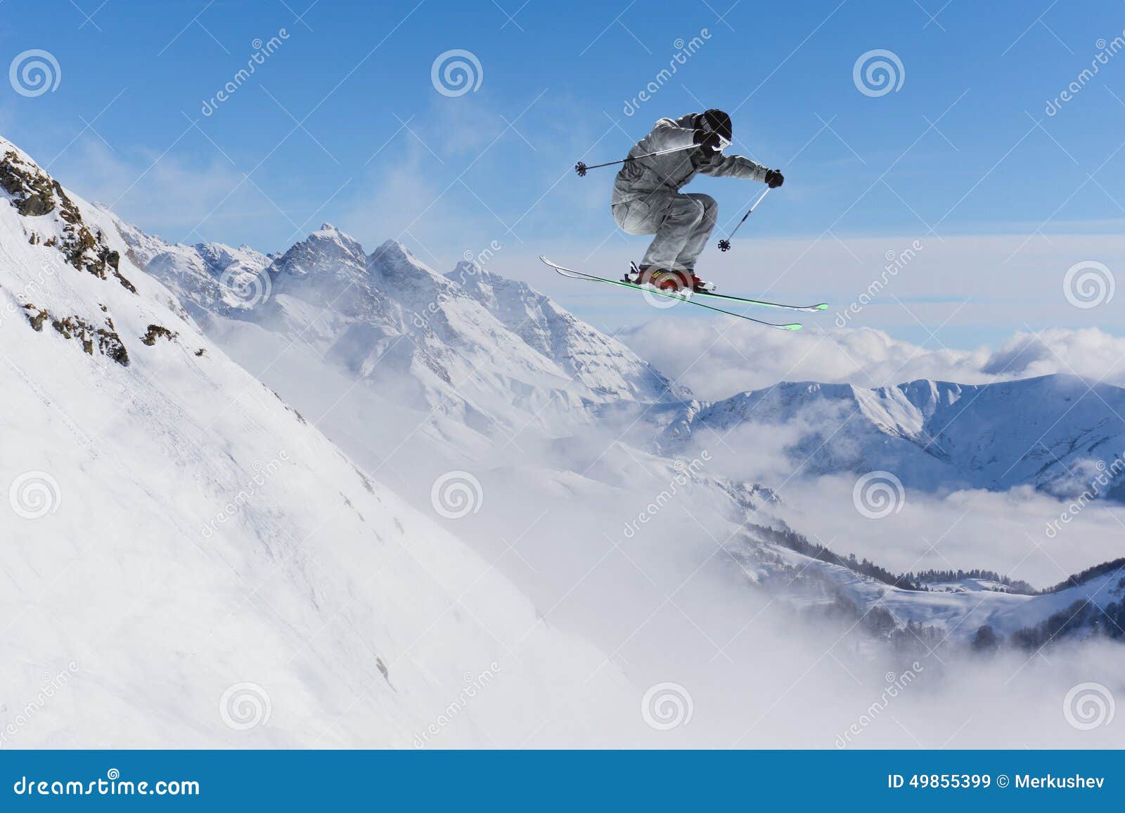 Flying skier on mountains stock image. Image of leisure - 49855399