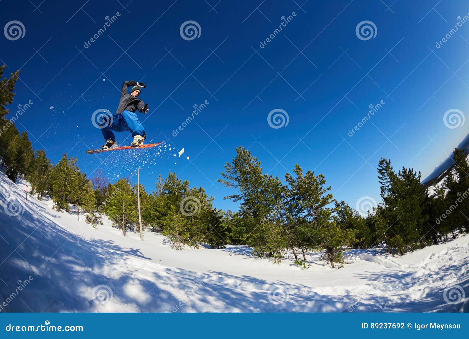 Flying Snowboarder in the Mountains Stock Photo - Image of blue ...