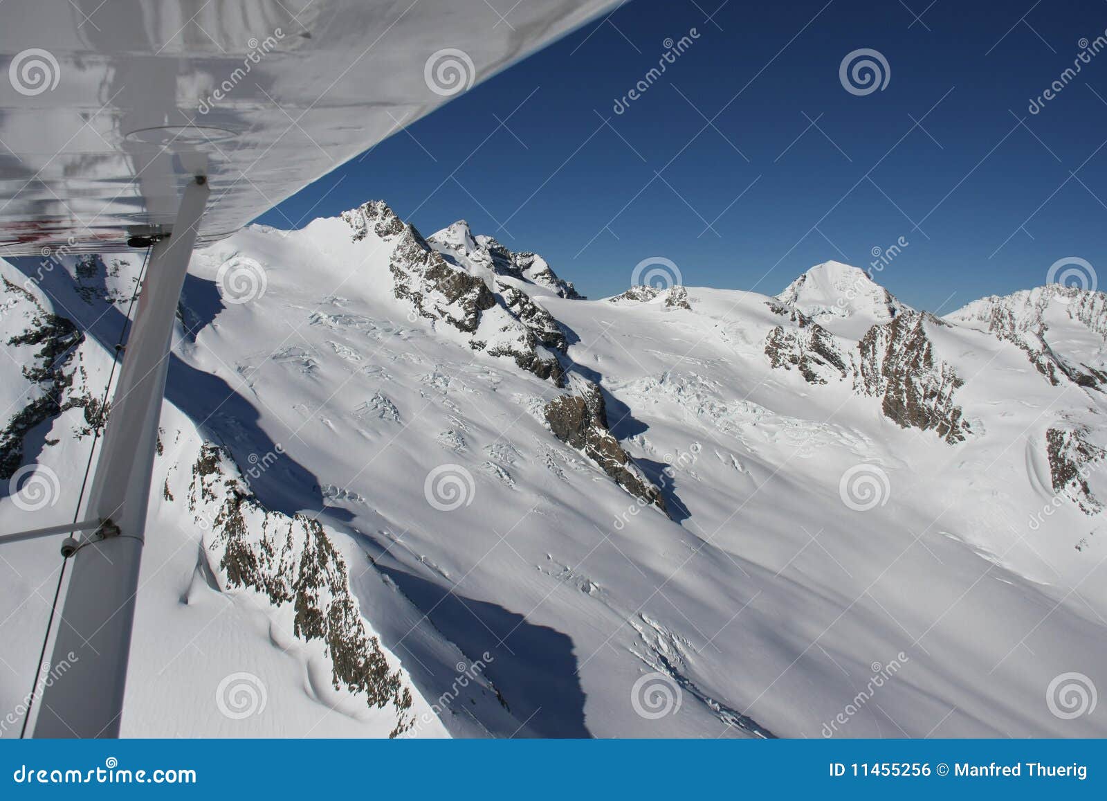 Flying in the Swiss Alps in Winter Stock Photo - Image of frost ...