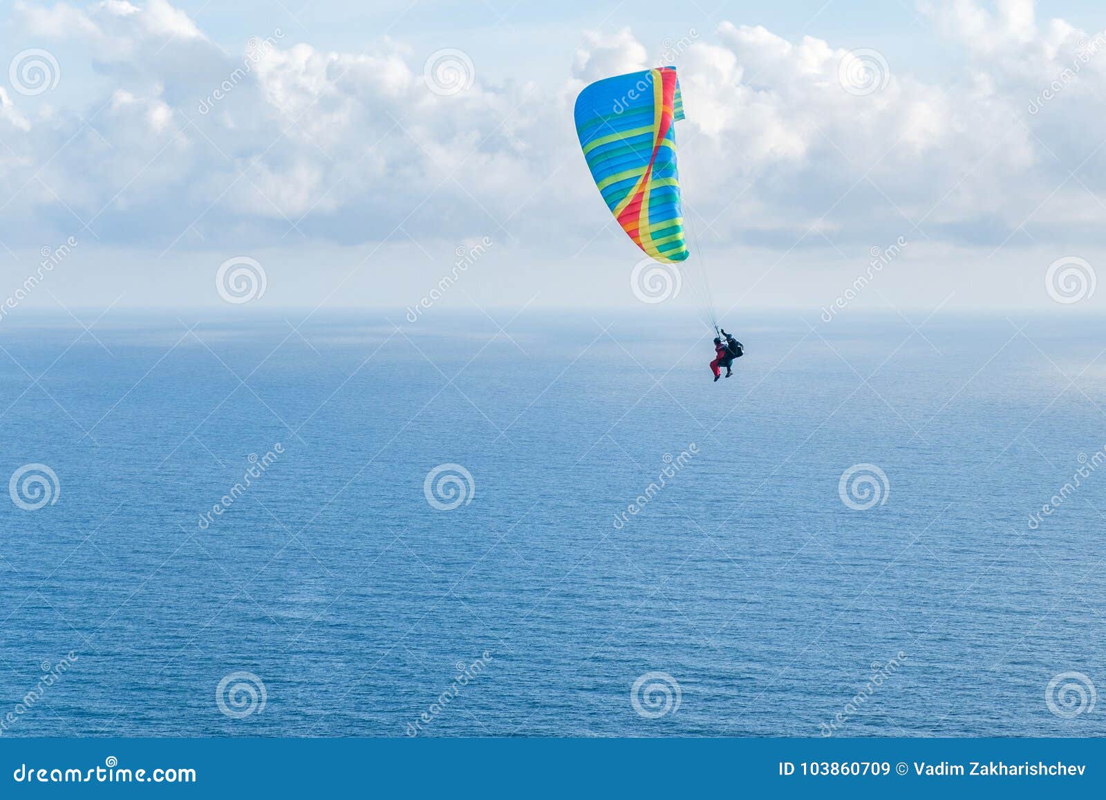 Flying a Tandem Paraglider Over the Sea with Views of the Horizon Stock ...