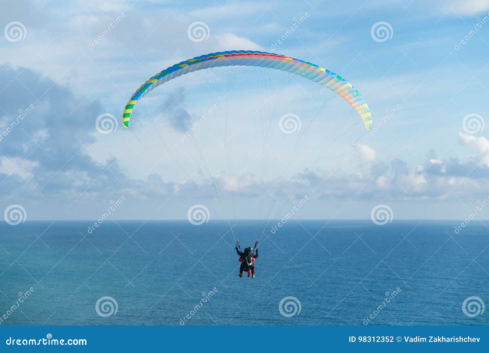 Flying a Tandem Paraglider Over the Sea with Views of the Horizon Stock ...