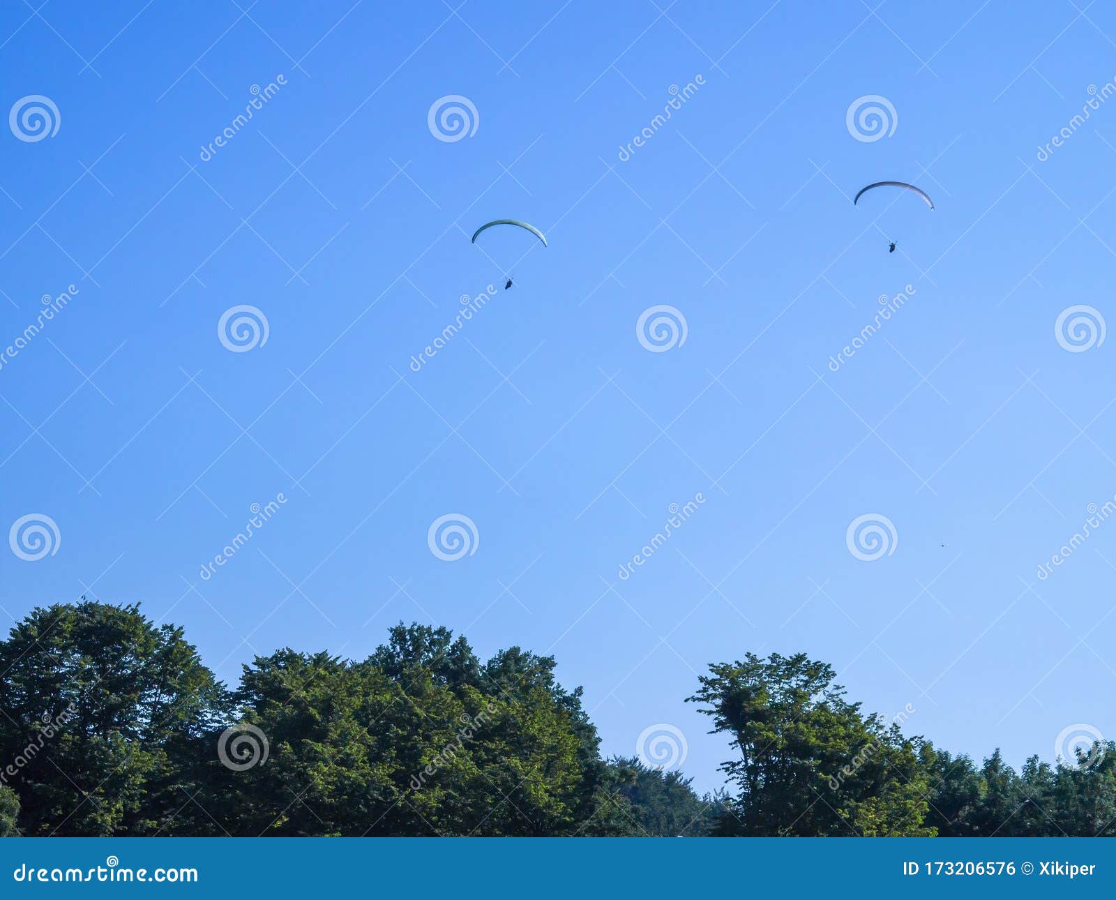 Flying Together with Wind Parachutes Stock Photo - Image of flight ...