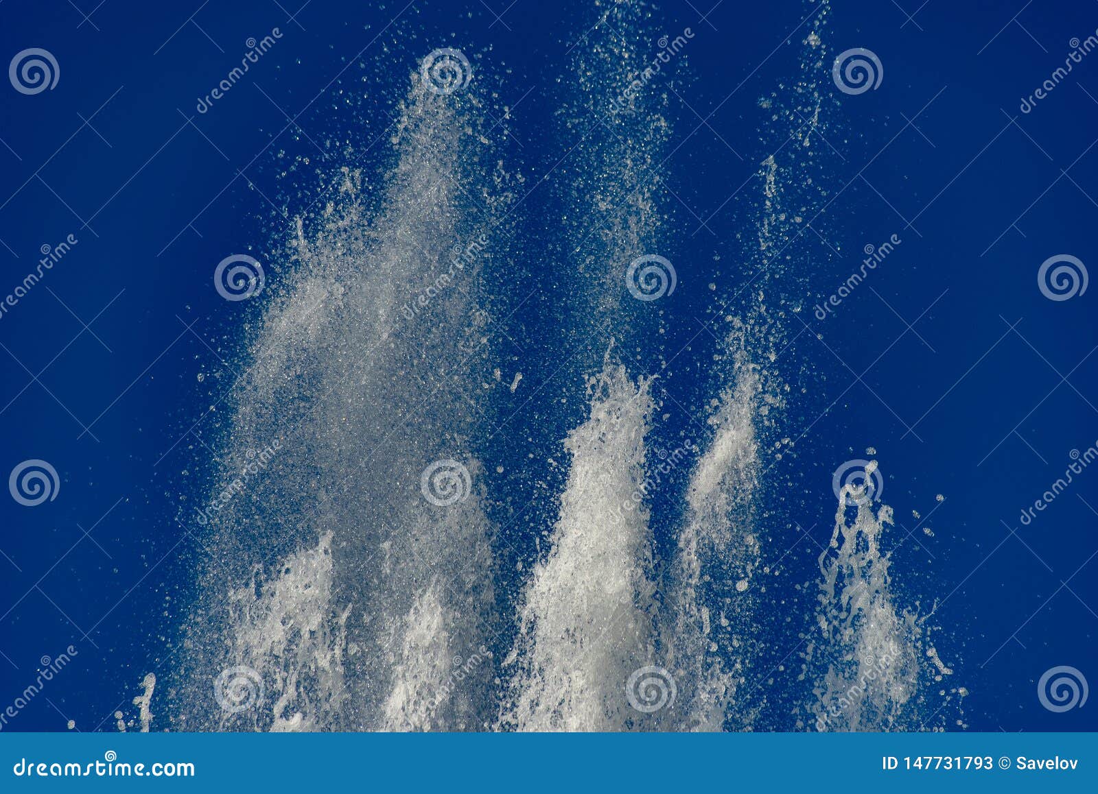 Flying Water Bursts on Blue Background Stock Image - Image of frozen ...