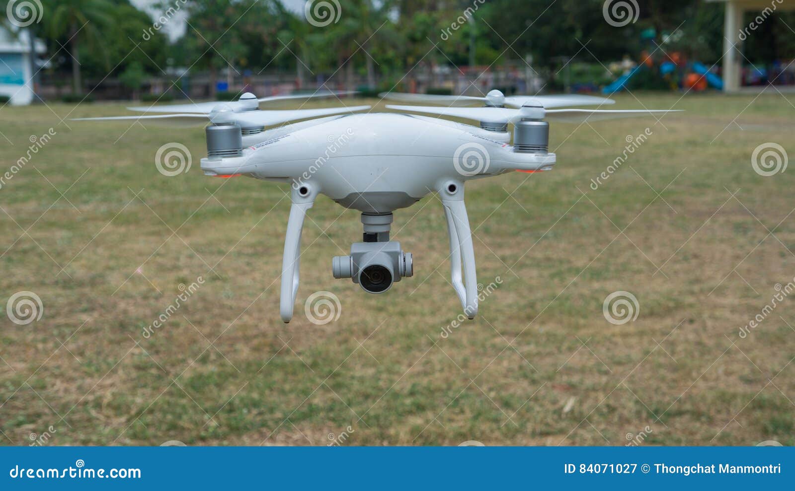 The flying white drone stock image. Image of camera, park - 84071027