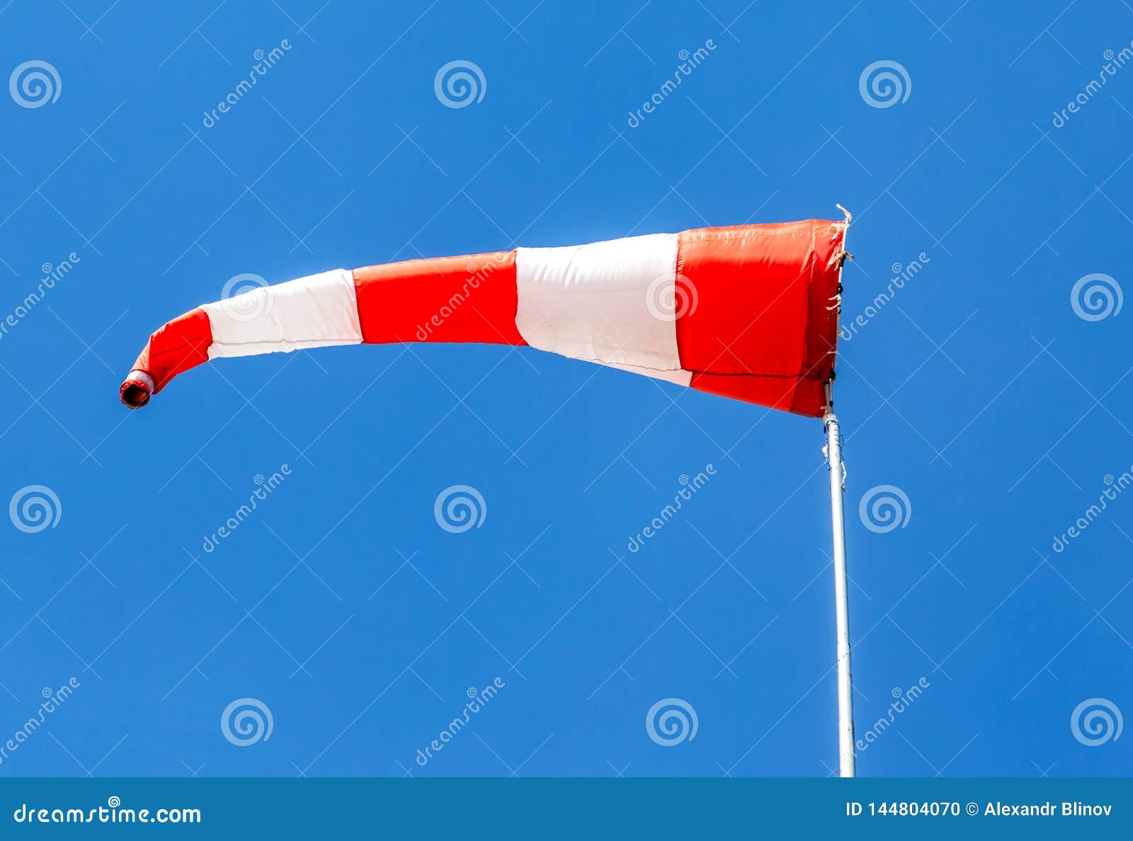 Flying Windsock Wind Vane with Red and White Lines Stock Photo - Image ...