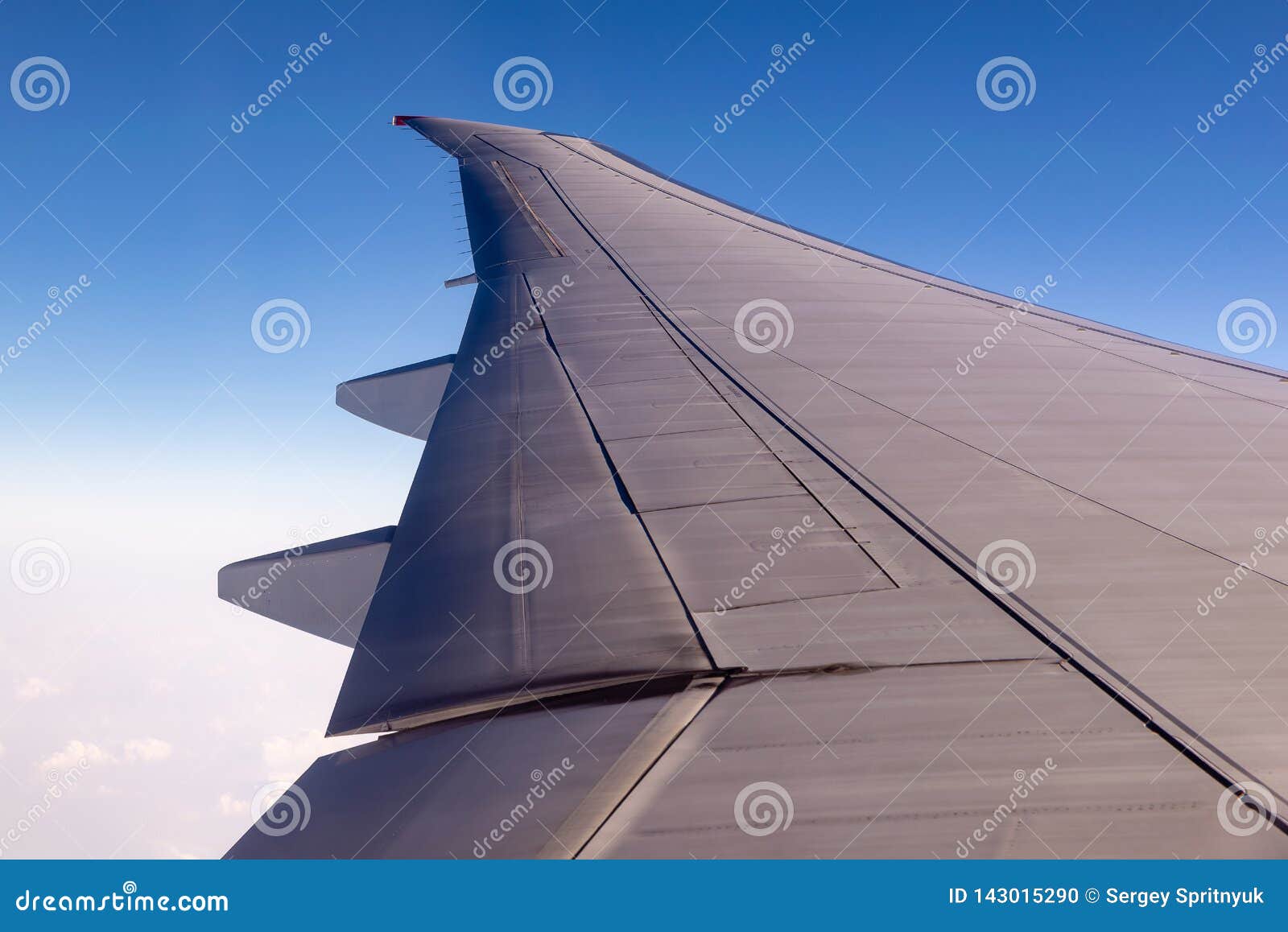 Flying Wing Passenger Aircraft on a Background of Blue Sky and Clouds ...