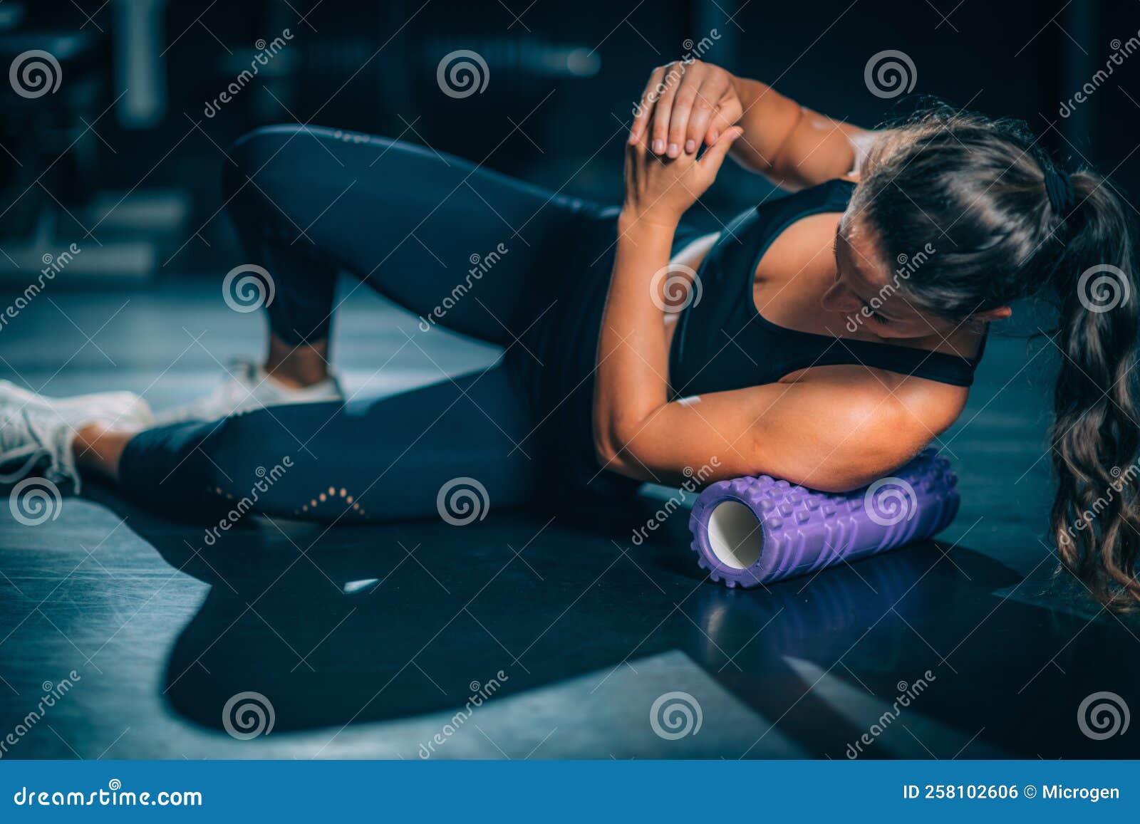 Foam Roller. Sportswoman Using Foam Roller Massager To Stretch Muscles ...
