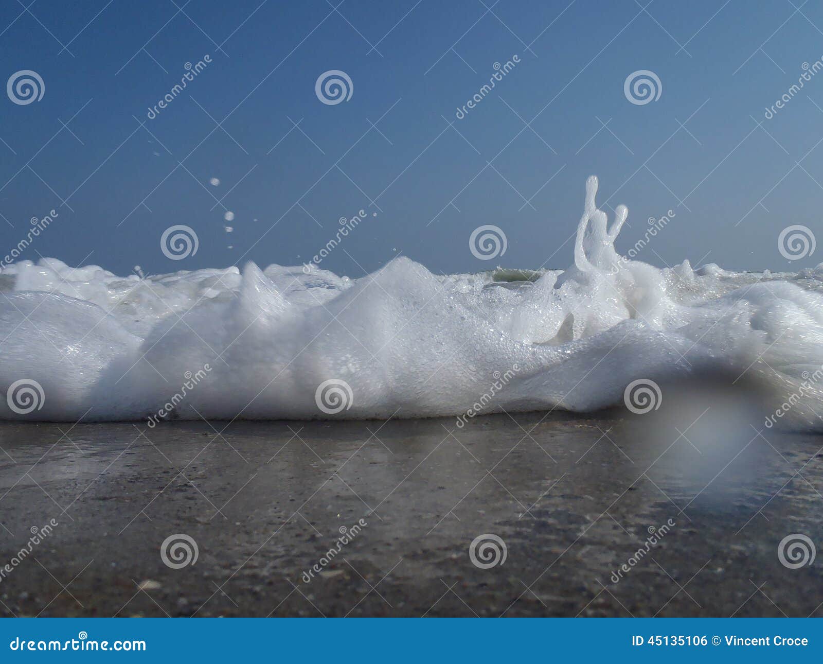Foam on top of wave stock photo. Image of beach, rockaway - 45135106
