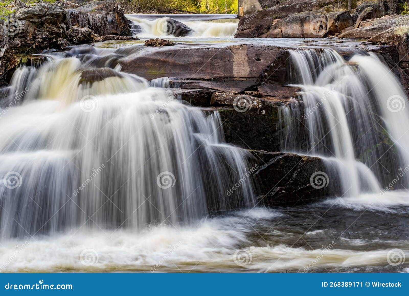 Foamy Cascade Flowing into the Water with Splashes Stock Image - Image ...