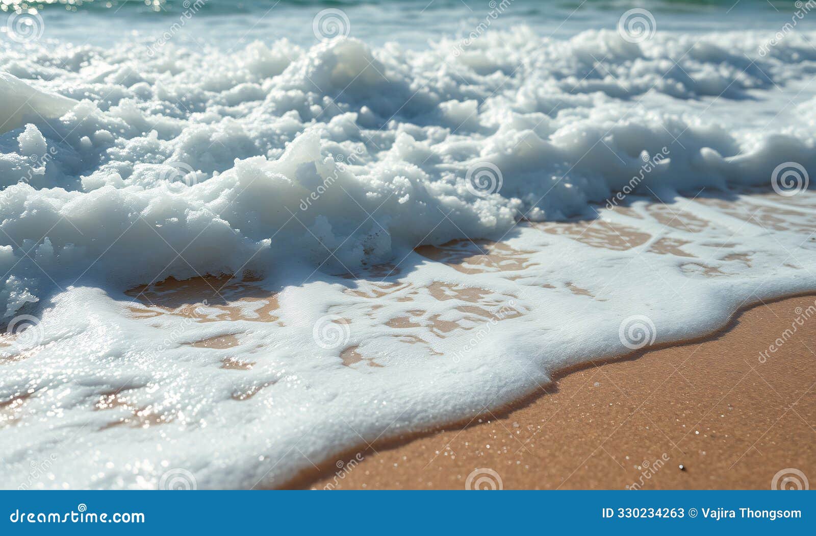 Foamy Ocean Waves Rolling Up Onto A Sandy Beach Royalty-Free Stock ...