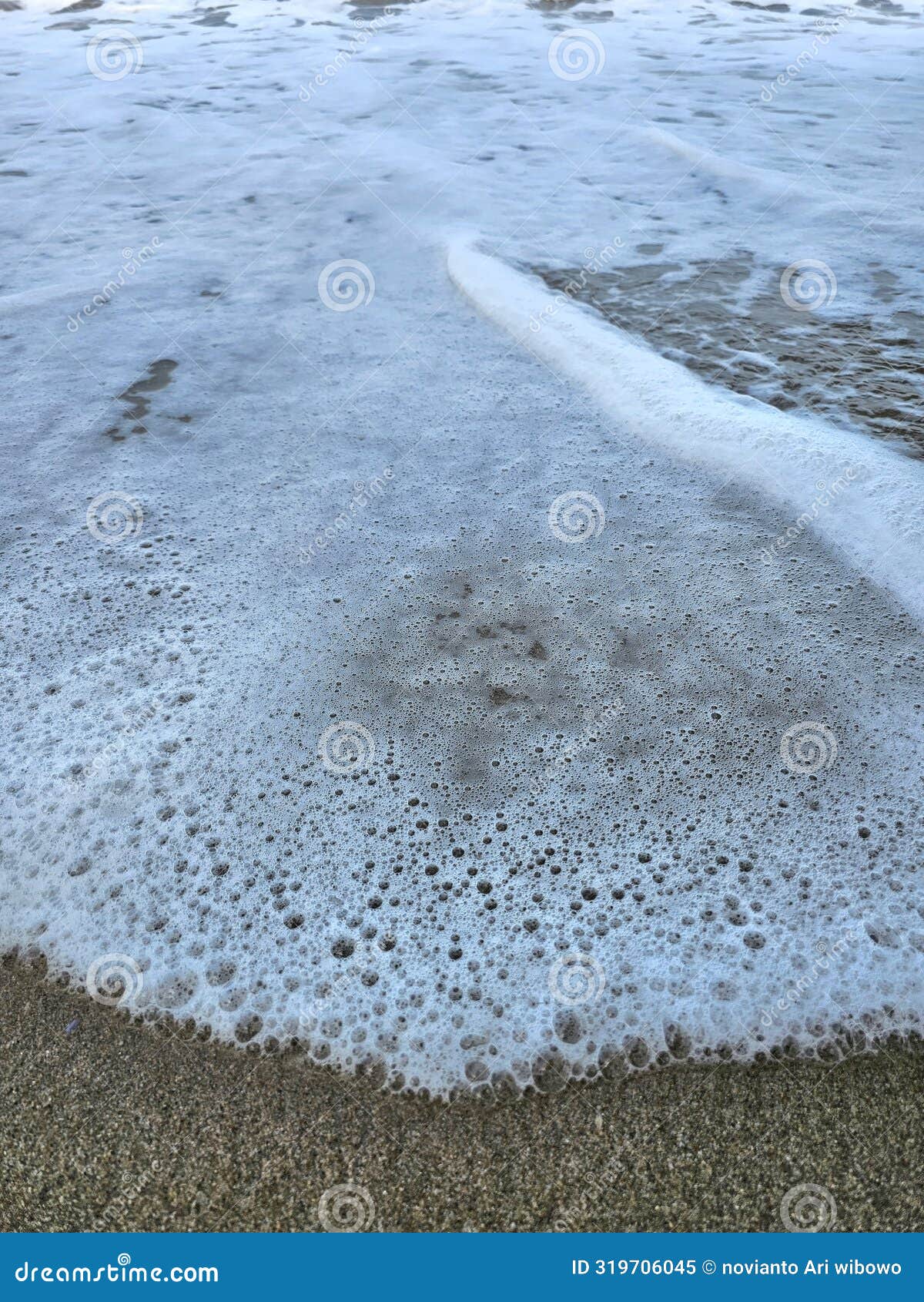 Foamy Sea Water Covering the Sand on the Beach Stock Image - Image of ...