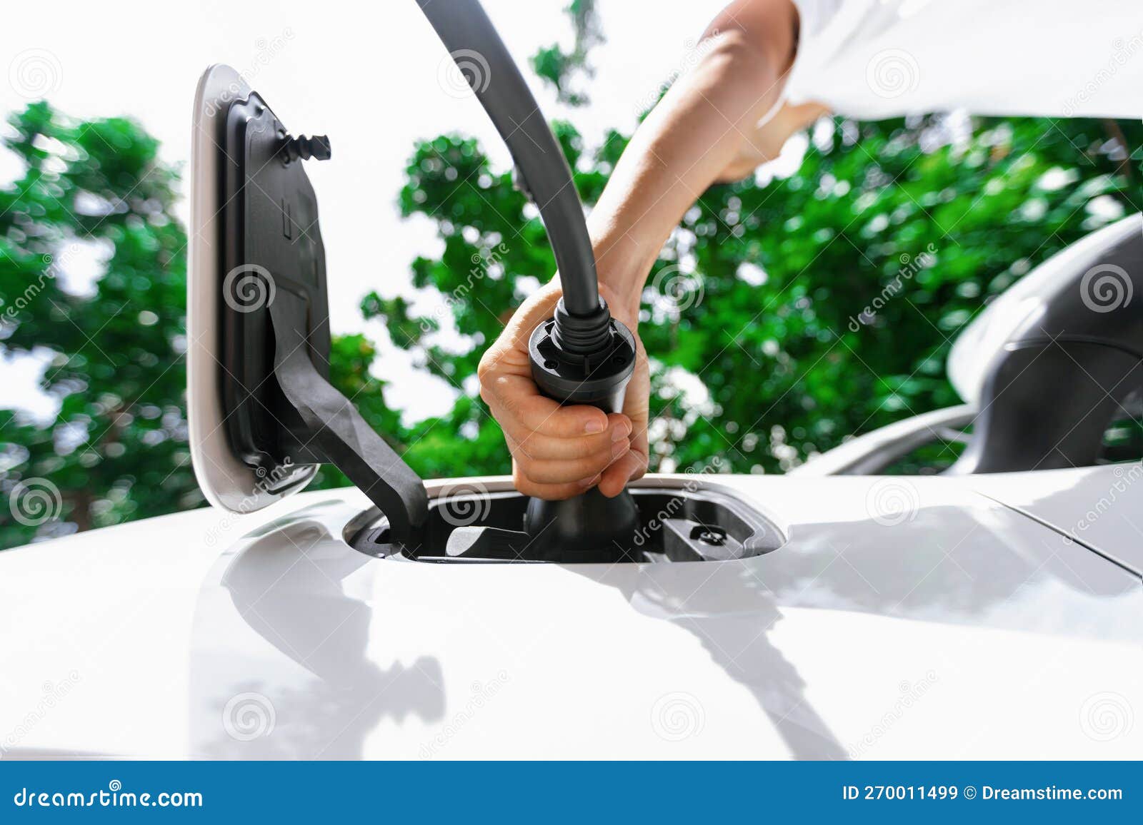 Progressive Focus Shot, Hand Insert Charger To Electric Car with Blur ...
