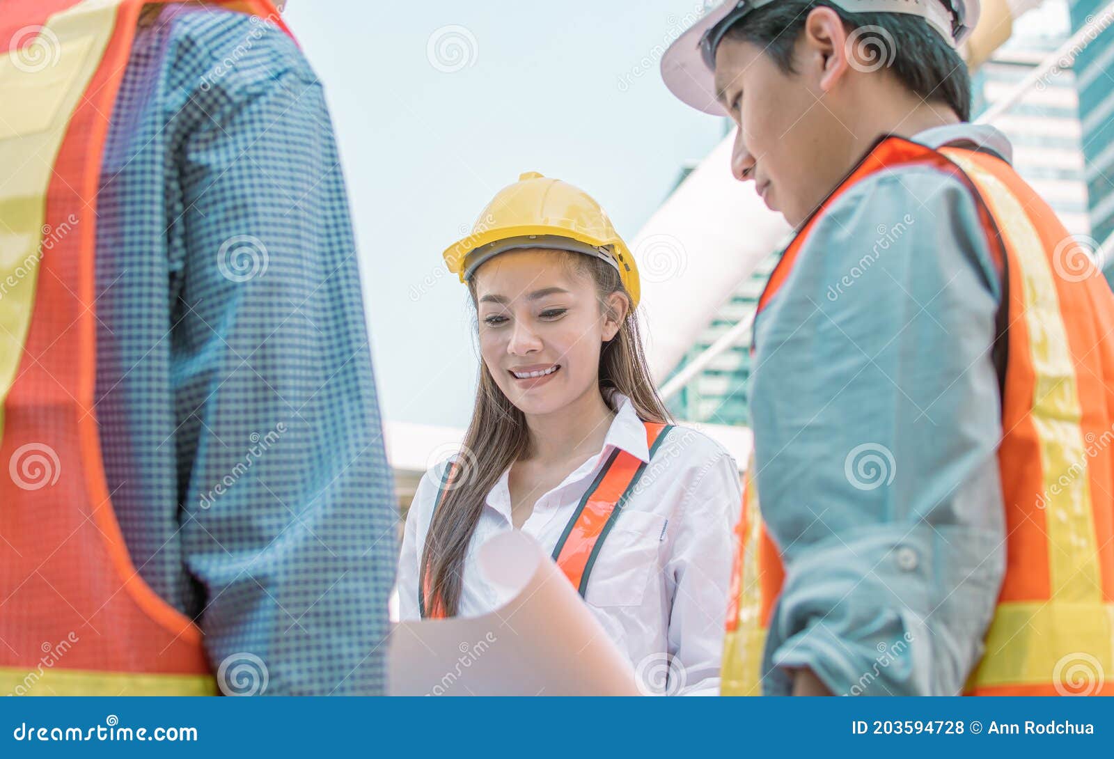 Focus on Female Engineer Looking at Paper for Project Planning Stock ...