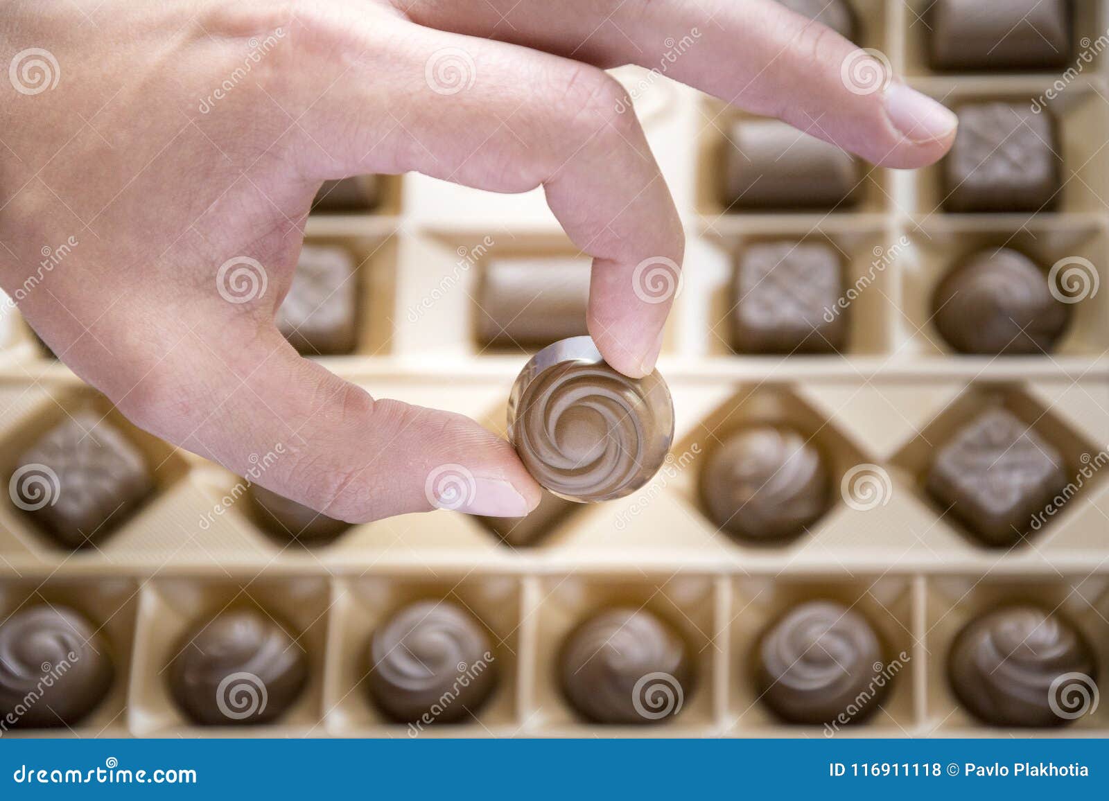 Human Fingers Keeping Round Chocolate Sweetmeat Stock Photo - Image of ...