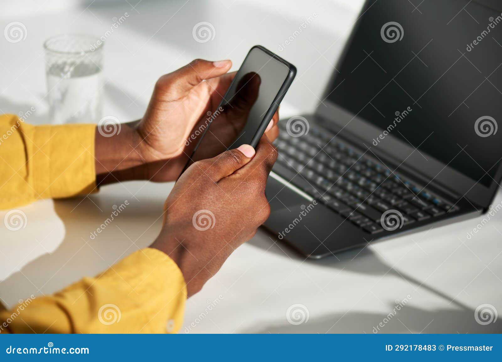 Focus on Hands of Black Man with Mobile Phone Texting or Scrolling ...