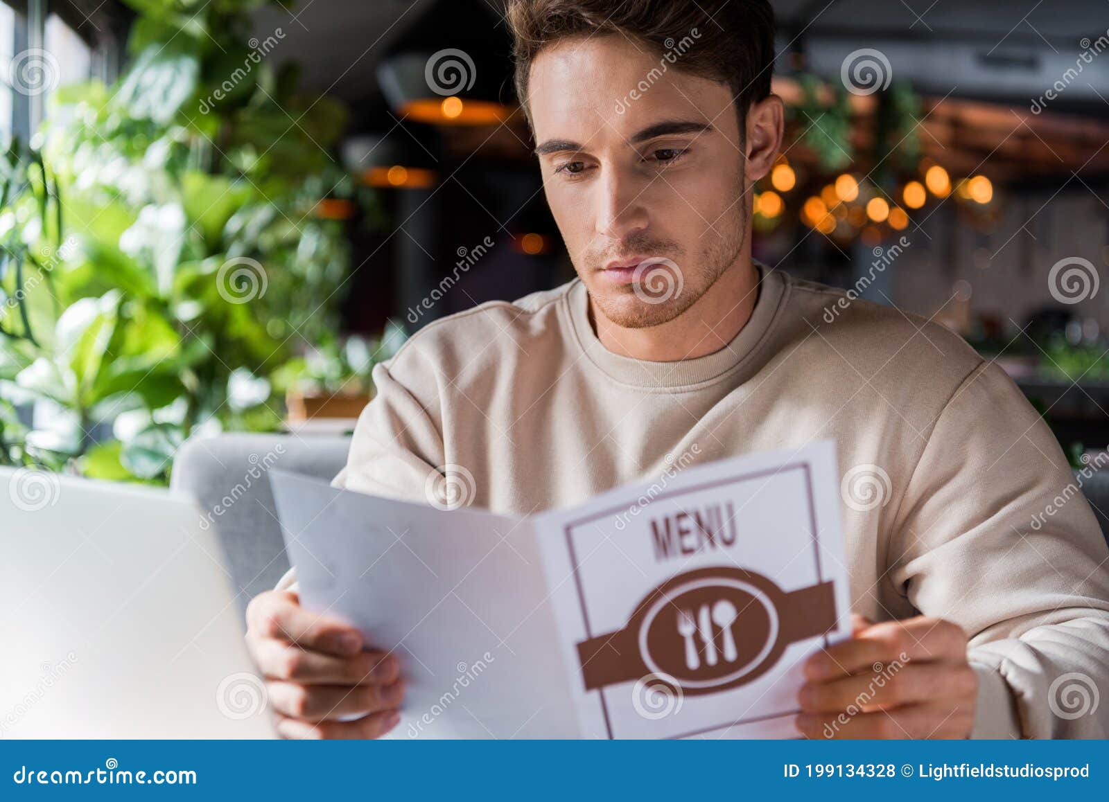 Focus of Handsome Man Holding Menu in Restaurant Stock Photo - Image of ...