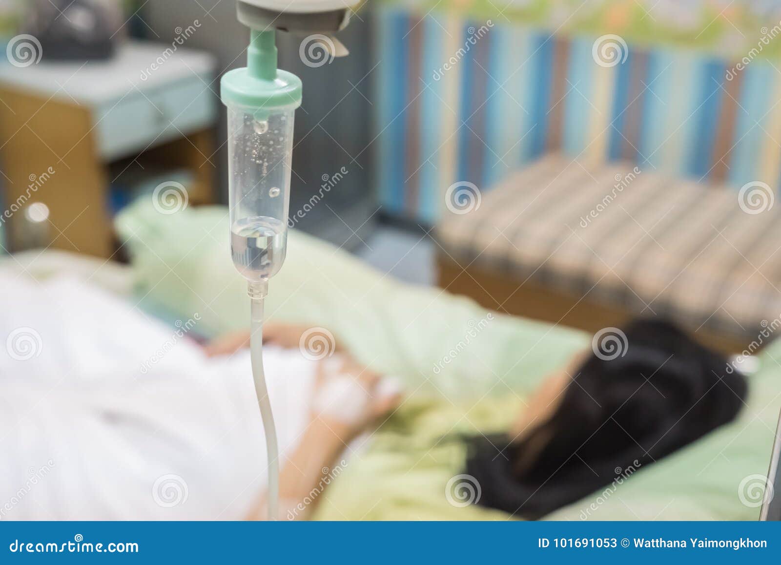 Focus on IV Drip Chamber with Patient in Hospital Stock Image - Image ...