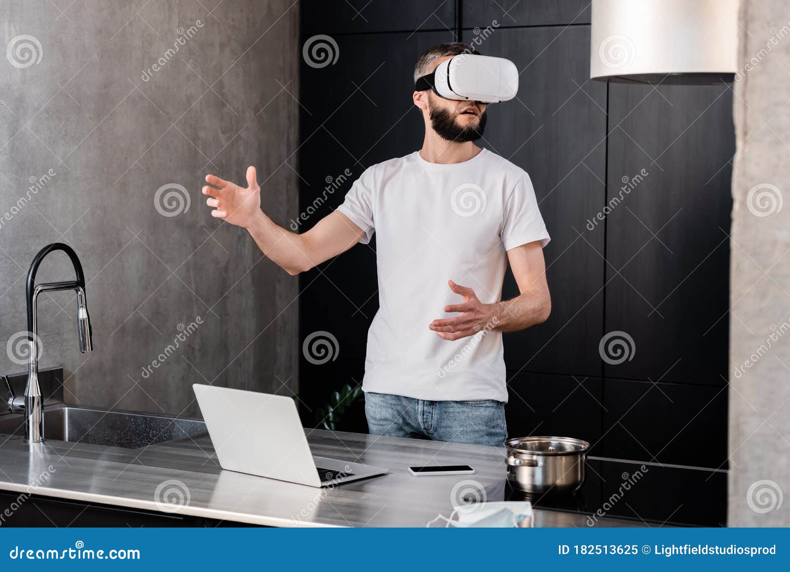 Focus of Man Using Vr Headset Near Gadgets and Medical Mask on Kitchen ...