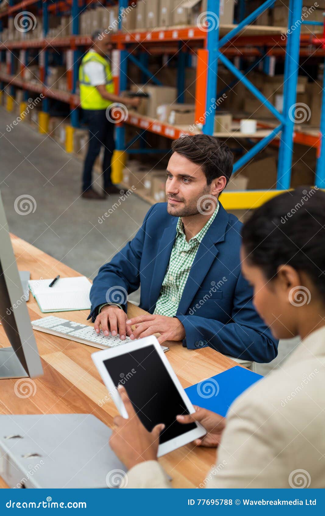 Focus on Manager is Working on a Computer with His Colleague Stock ...