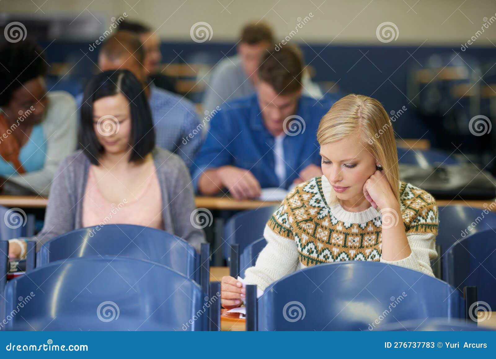 Focus Now for Later Success. a Group of College Students Studying in a ...