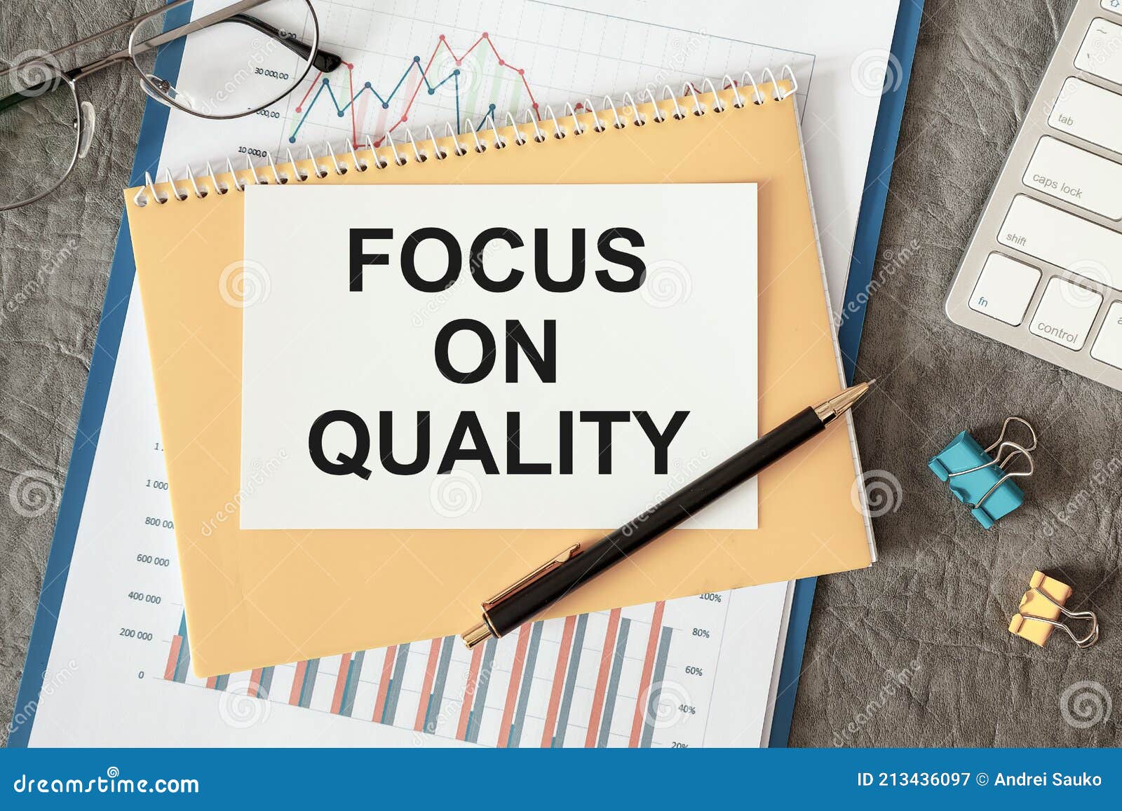 FOCUS on QUALITY is Written in a Document on the Office Desk Stock ...