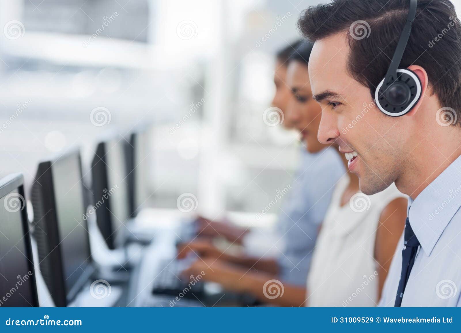 Focus on a Smiling Call Centre Agent Stock Image - Image of ...