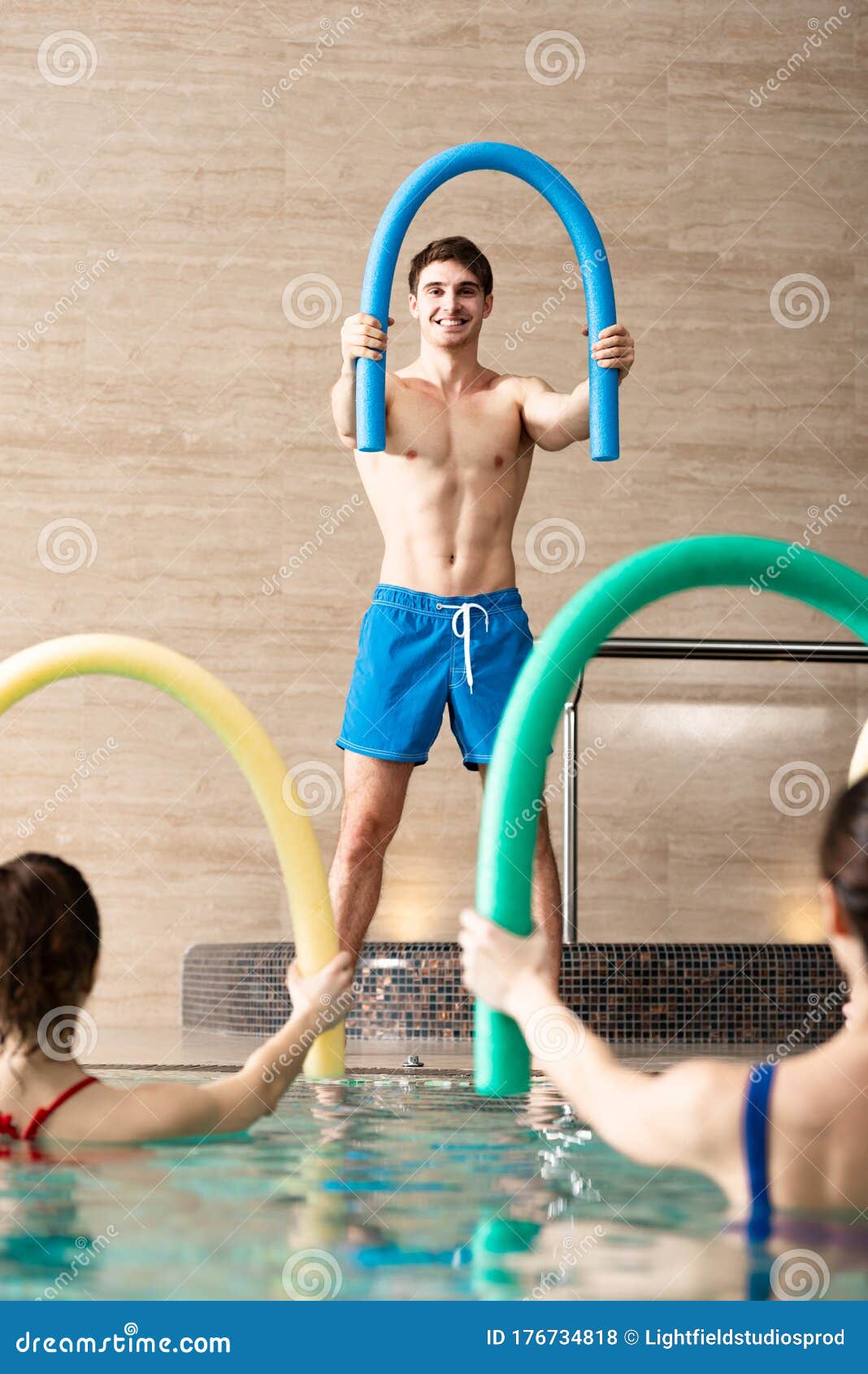 Focus of Smiling Trainer Exercising with Stock Photo - Image of torso ...