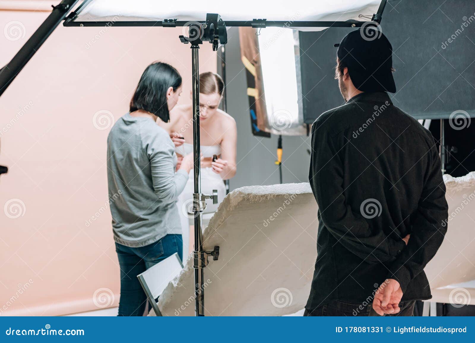Focus of Videographer, Model and Assistant in Photo Studio Stock Image ...