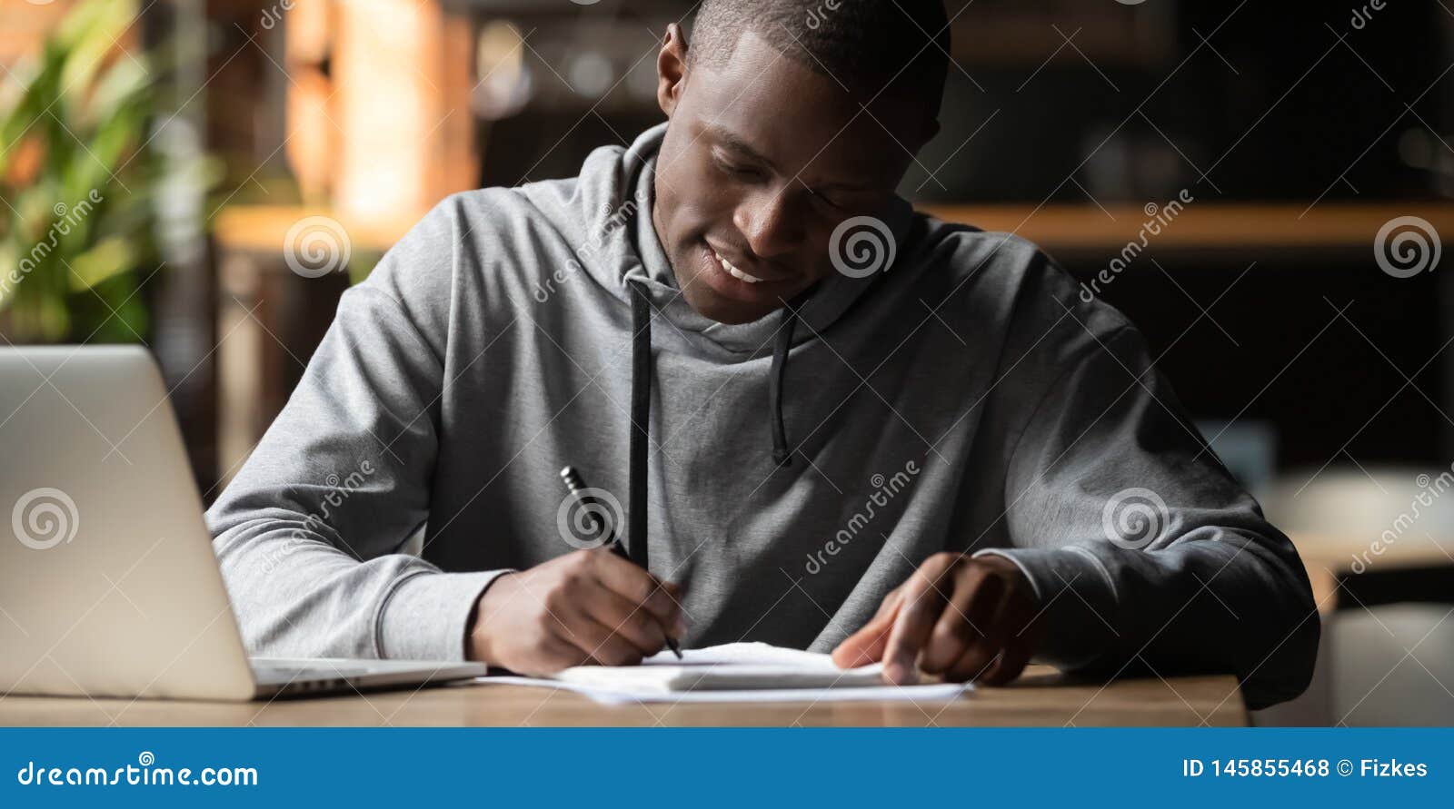 Focused African Student Sitting Indoors Write on Notebook Stock Photo ...