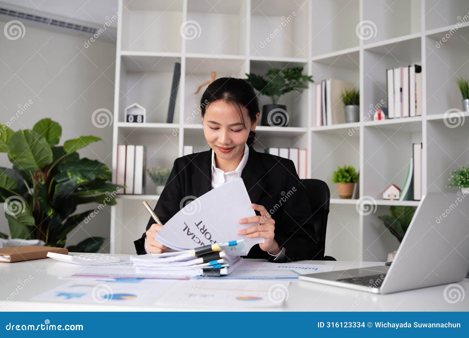 Focused Asian Female Accountant Doing Paperwork in Office with Plan ...