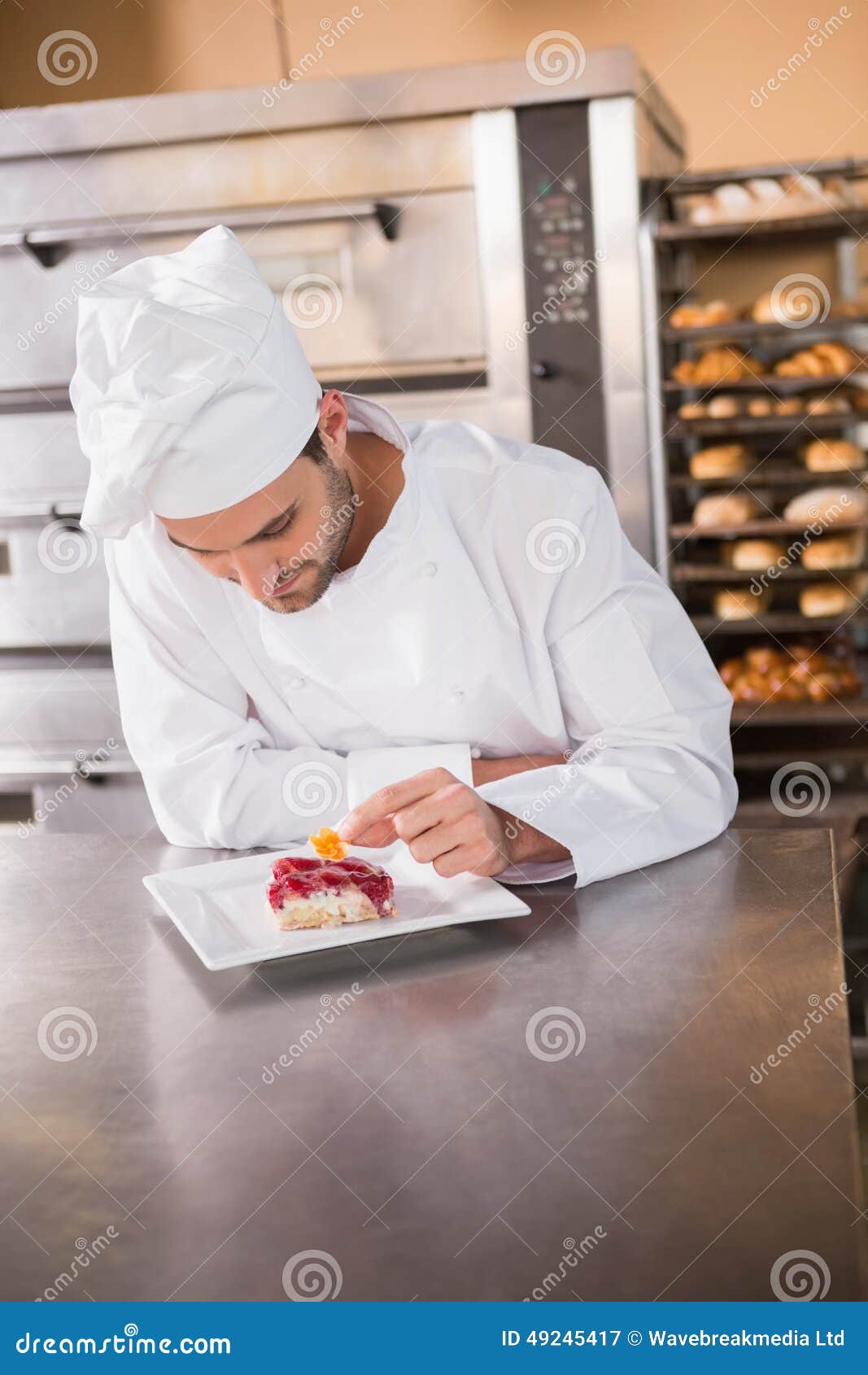 Focused Baker Putting Flower on the Pastry with Fruit Stock Image ...