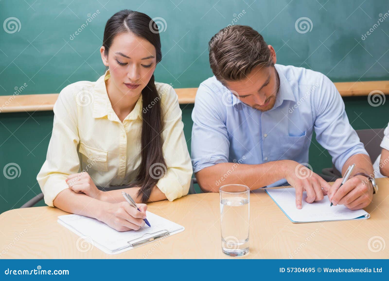 Focused Business People Taking Notes during Presentation Stock Image ...