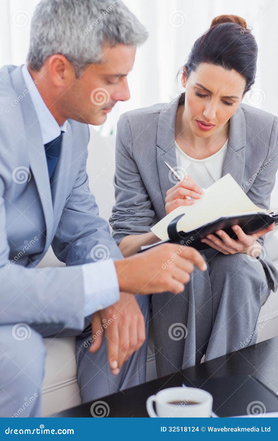 Focused Business People Working and Talking Together on Sofa Stock ...