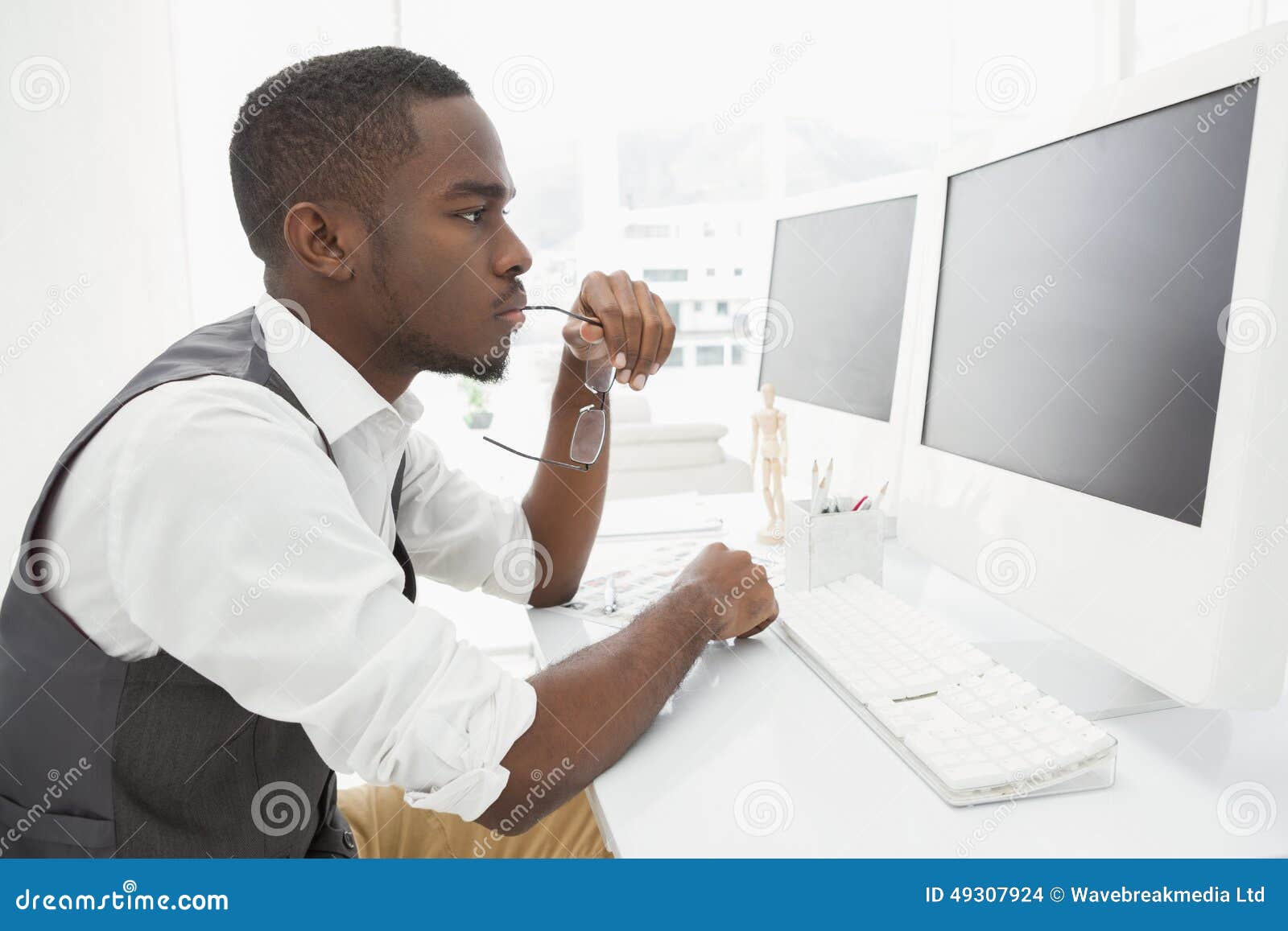 Focused Businessman Working On Statistics Report Using Computer Stock ...