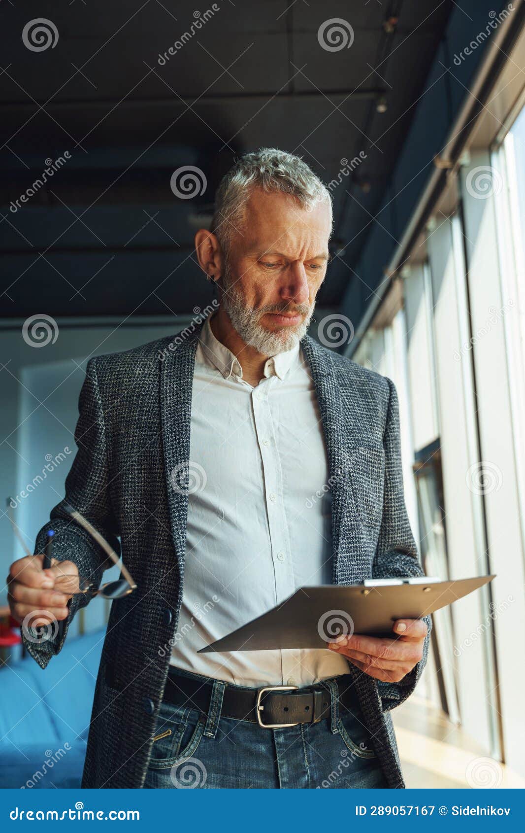 Focused Businessman Looking on Documents and Think How To Solve Problem ...