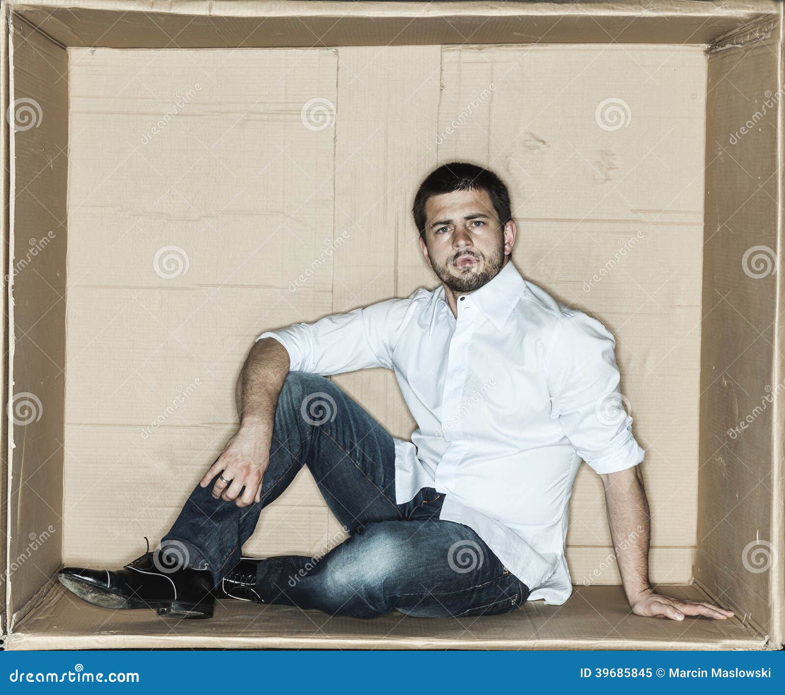 Focused Businessman Sitting in a Box Stock Image - Image of cardboard ...