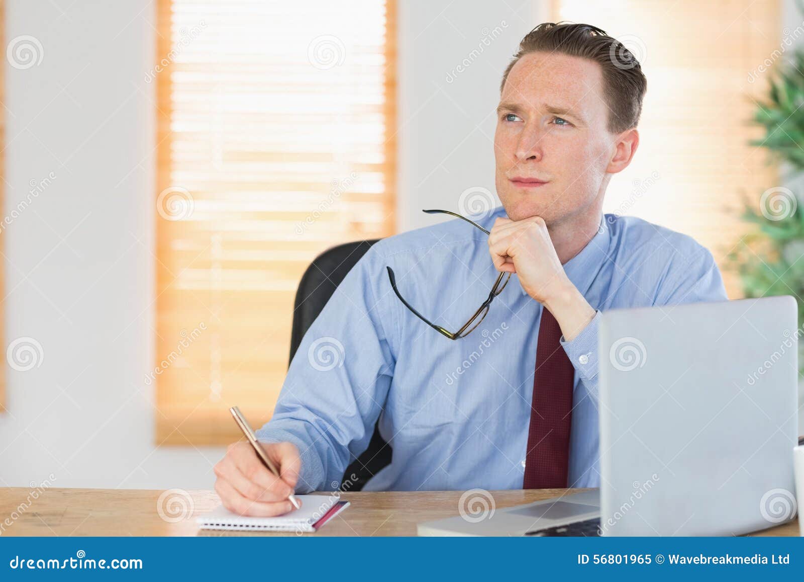 Focused Businessman Sitting at His Desk Stock Image - Image of noting ...