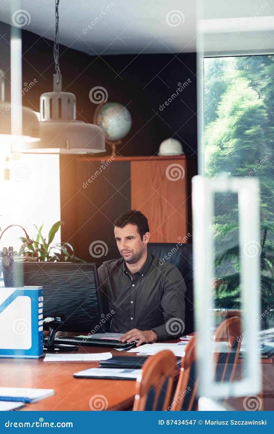 Focused Businessman at Work on a Computer in an Office Stock Image ...