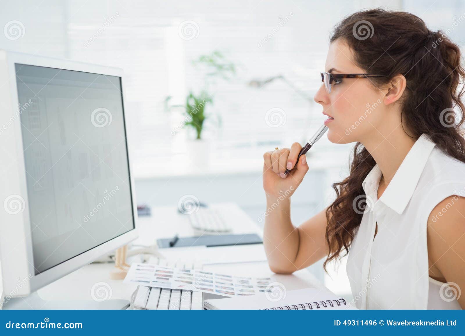 Focused Businesswoman with Glasses Using Computer Stock Photo - Image ...