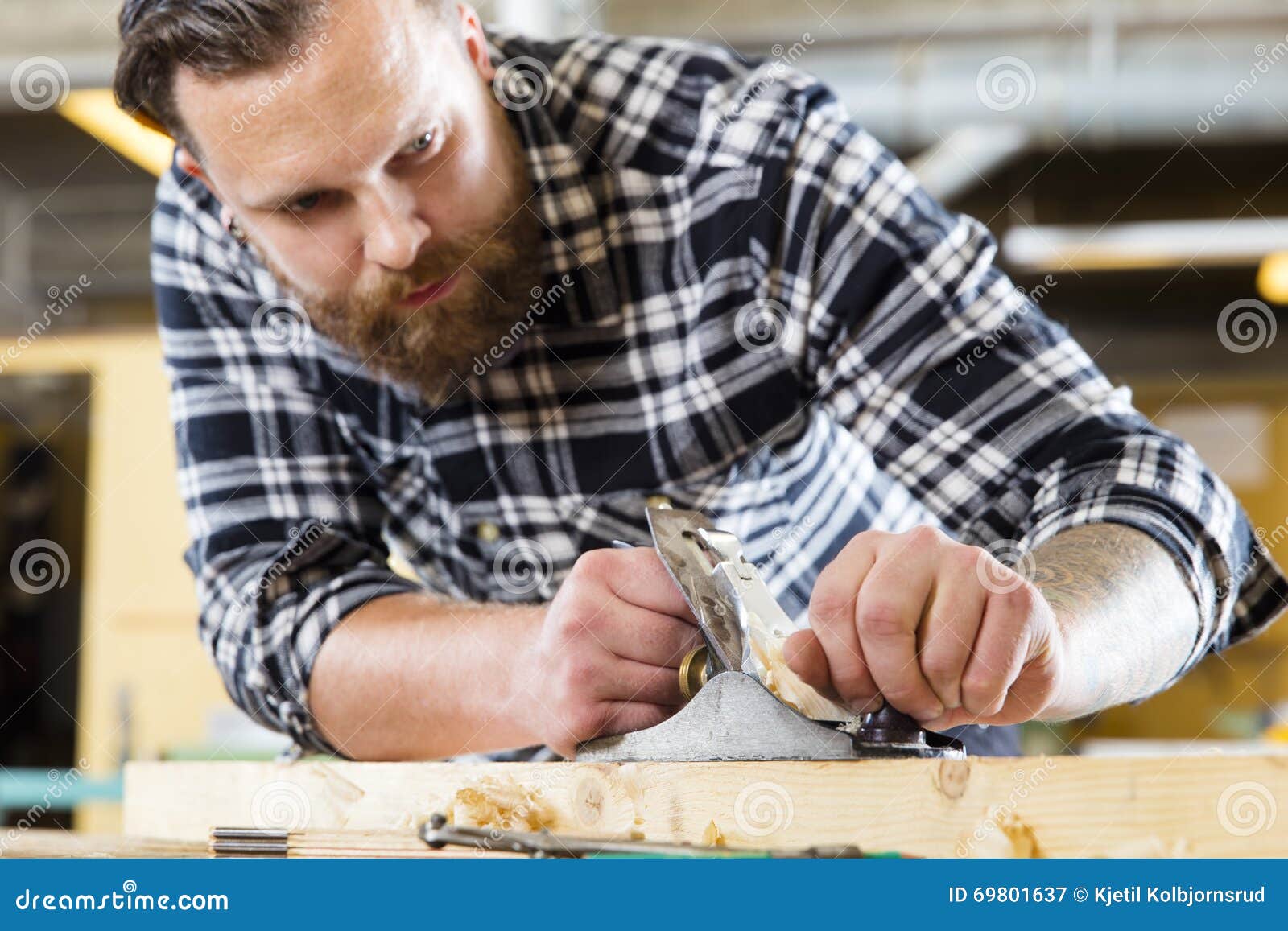 Focused Carpenter Work with Plane on Wood Plank in Workshop Stock Image ...