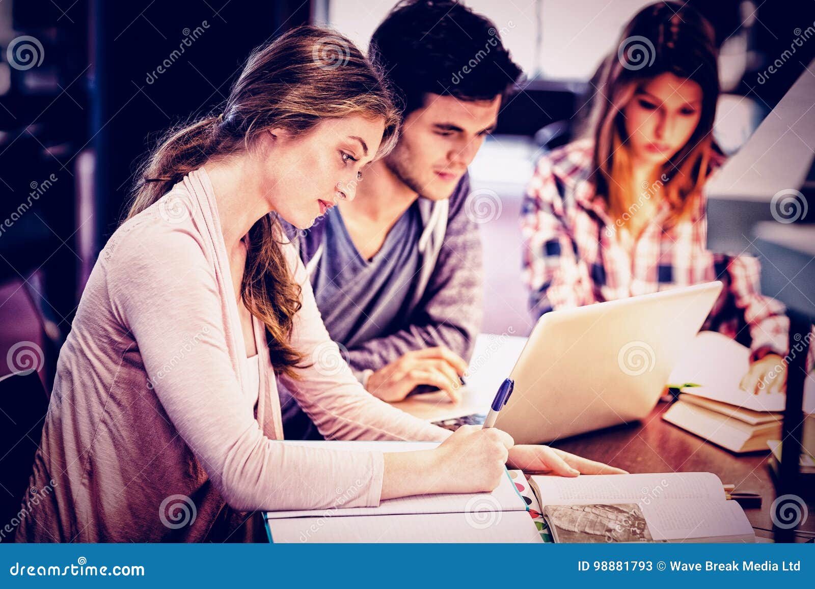 Focused Classmates Studying Together while Using Laptop Stock Image ...