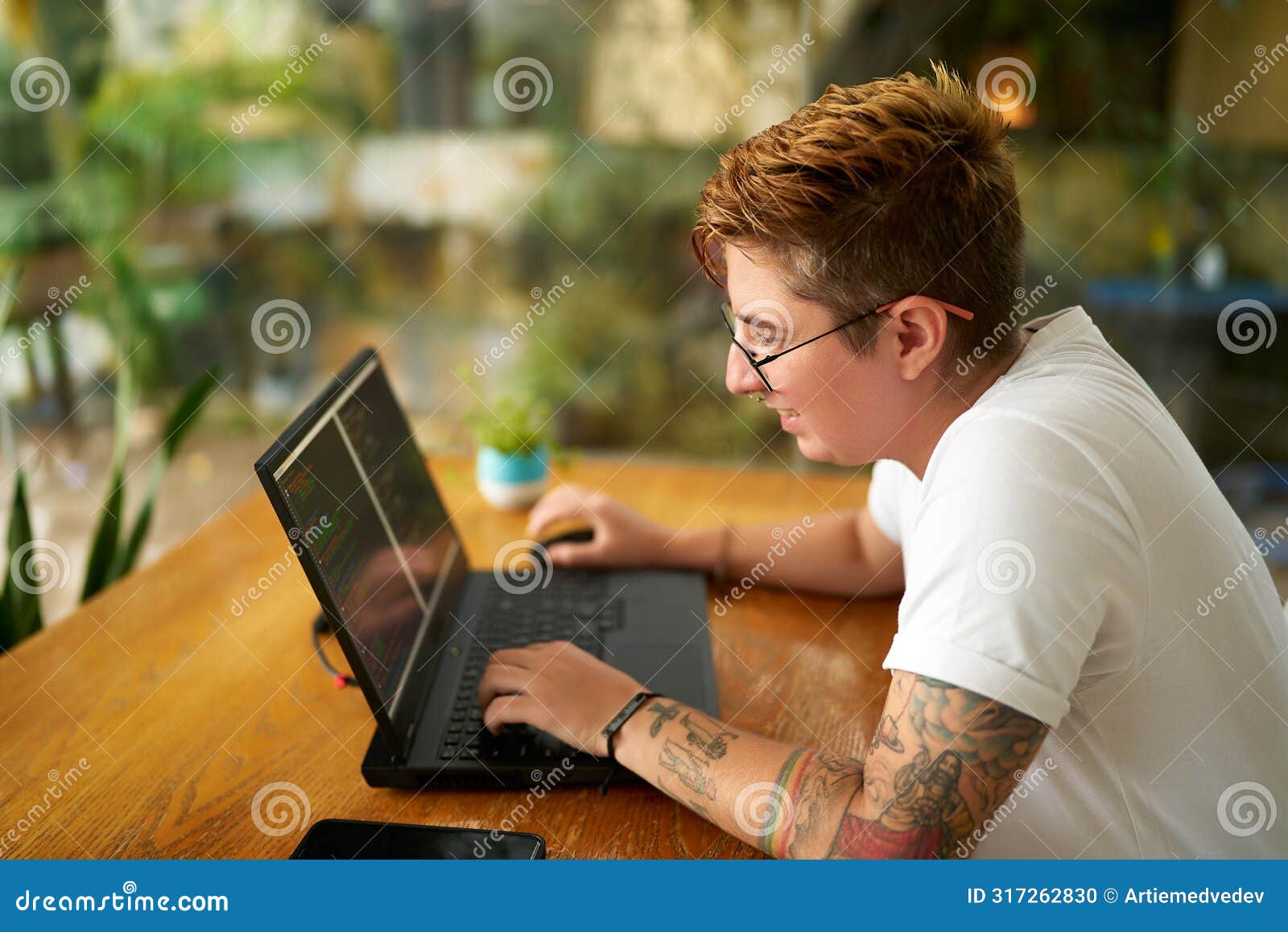 Transgender Software Developer Programs at Wooden Desk. Focused on ...