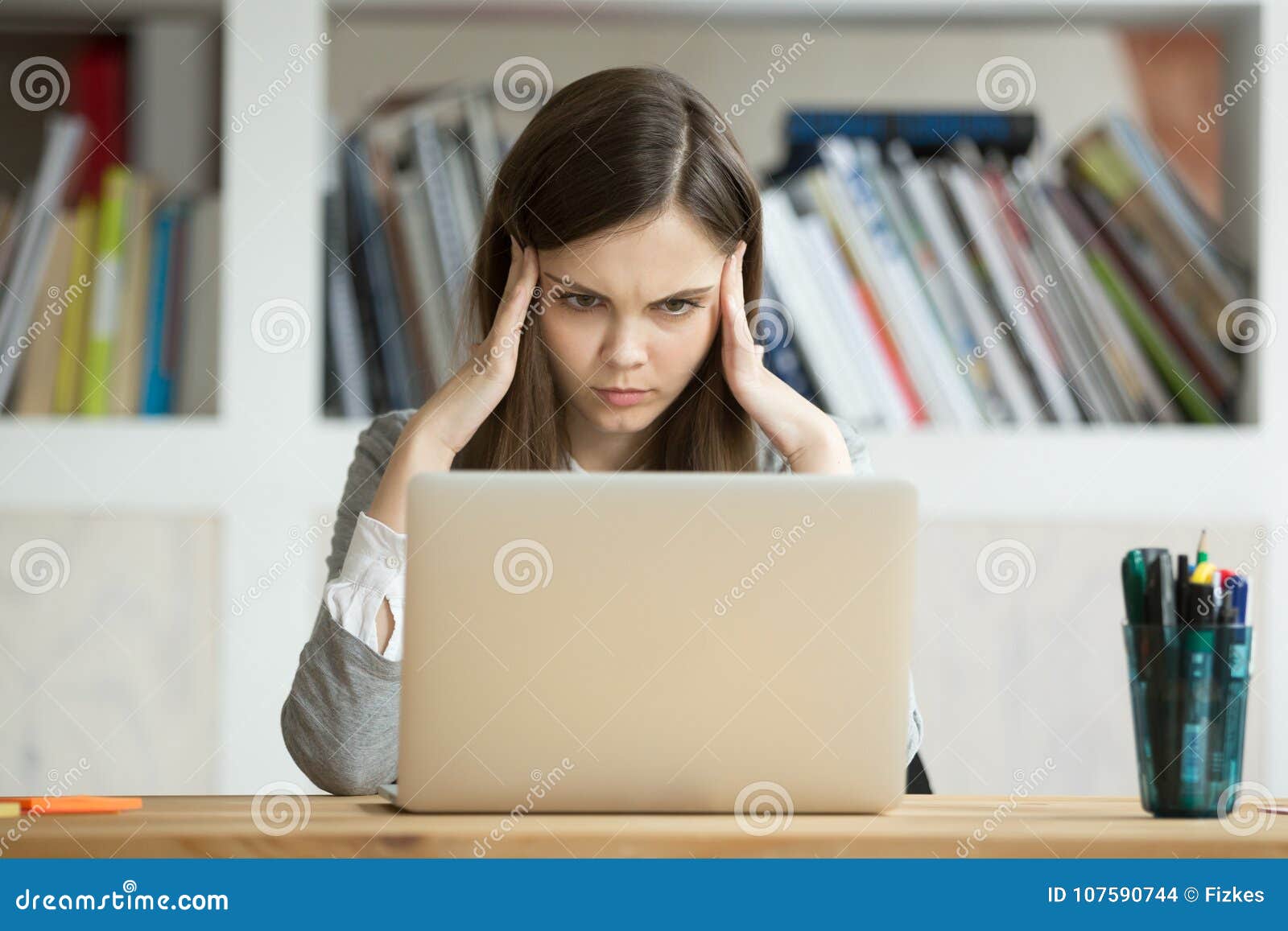 Focused Concerned Girl Student Learning Difficult Exam with Lapt Stock ...