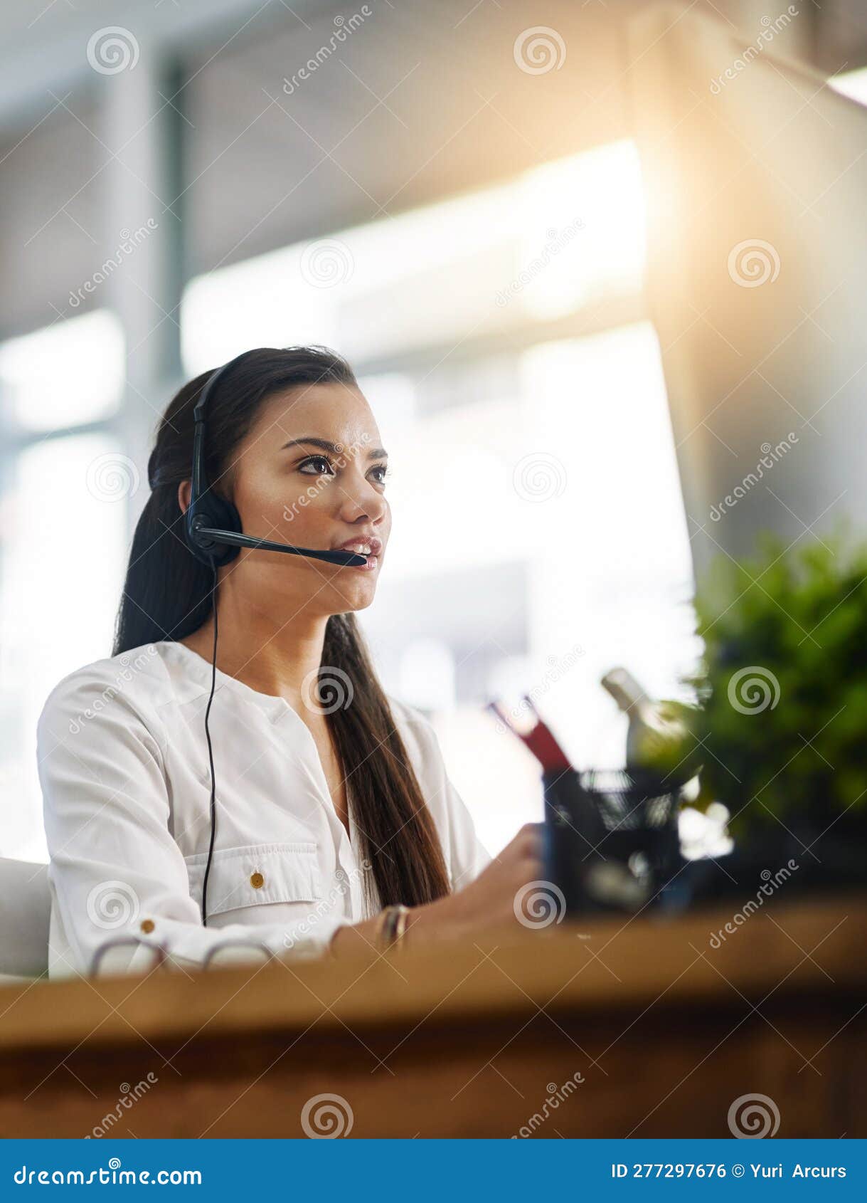 She is Focused when a Customer is on the Line. a Female Agent Working ...