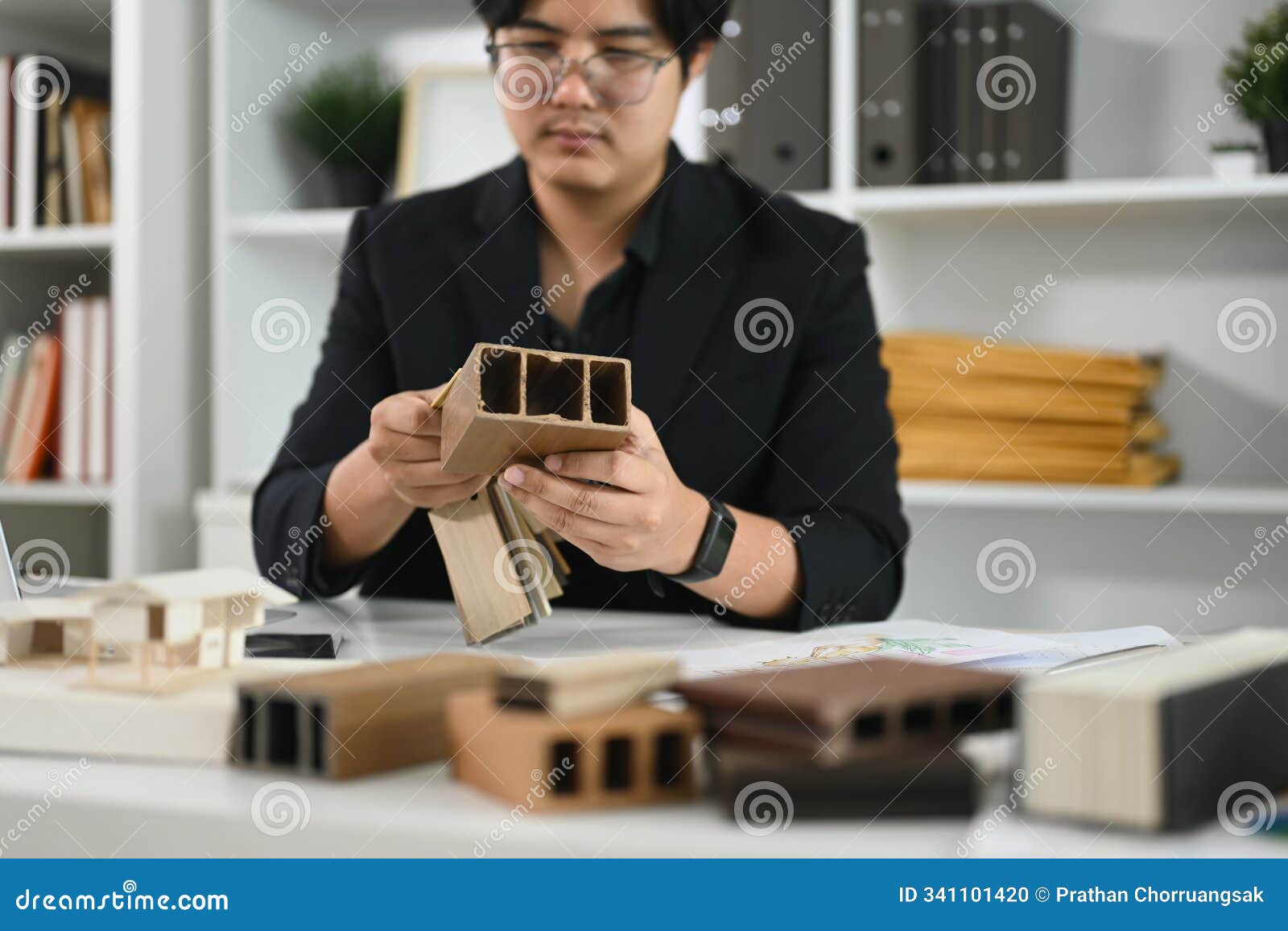 Focused Designer or Architect Examining a Building Material or ...