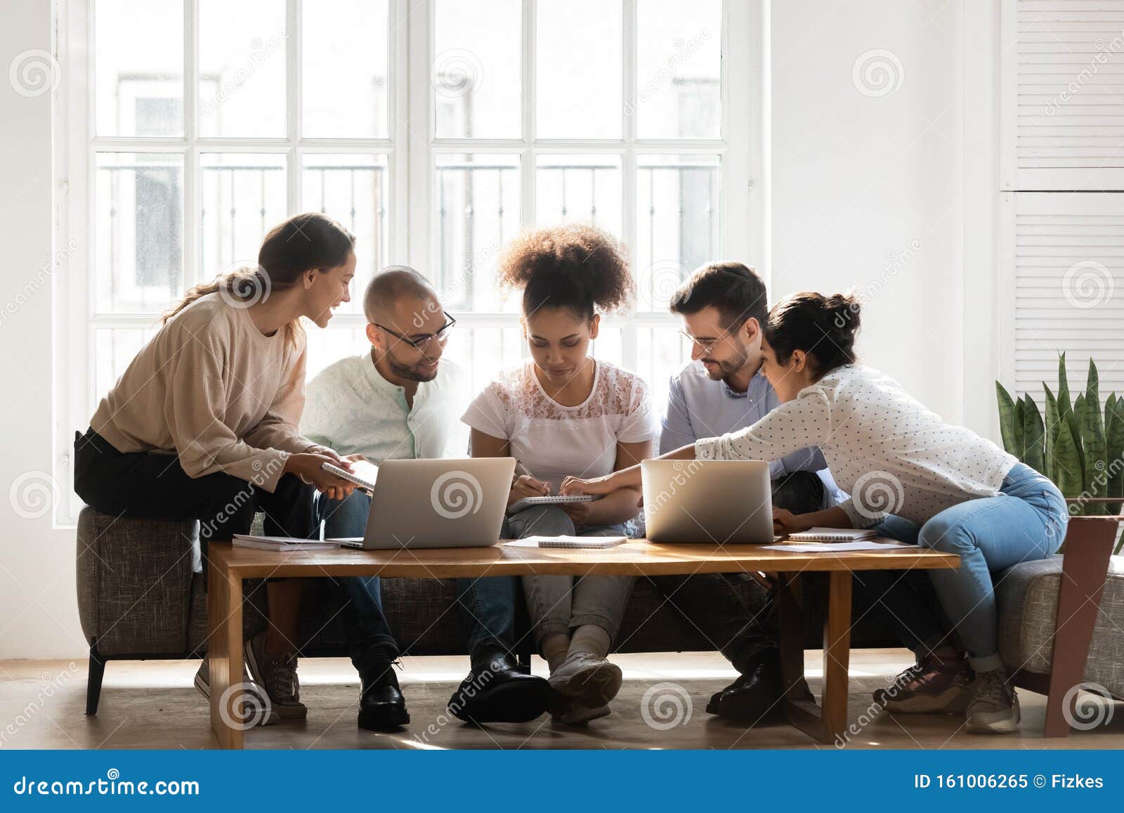 Focused Diverse Students Working on Research Project Together at Home ...