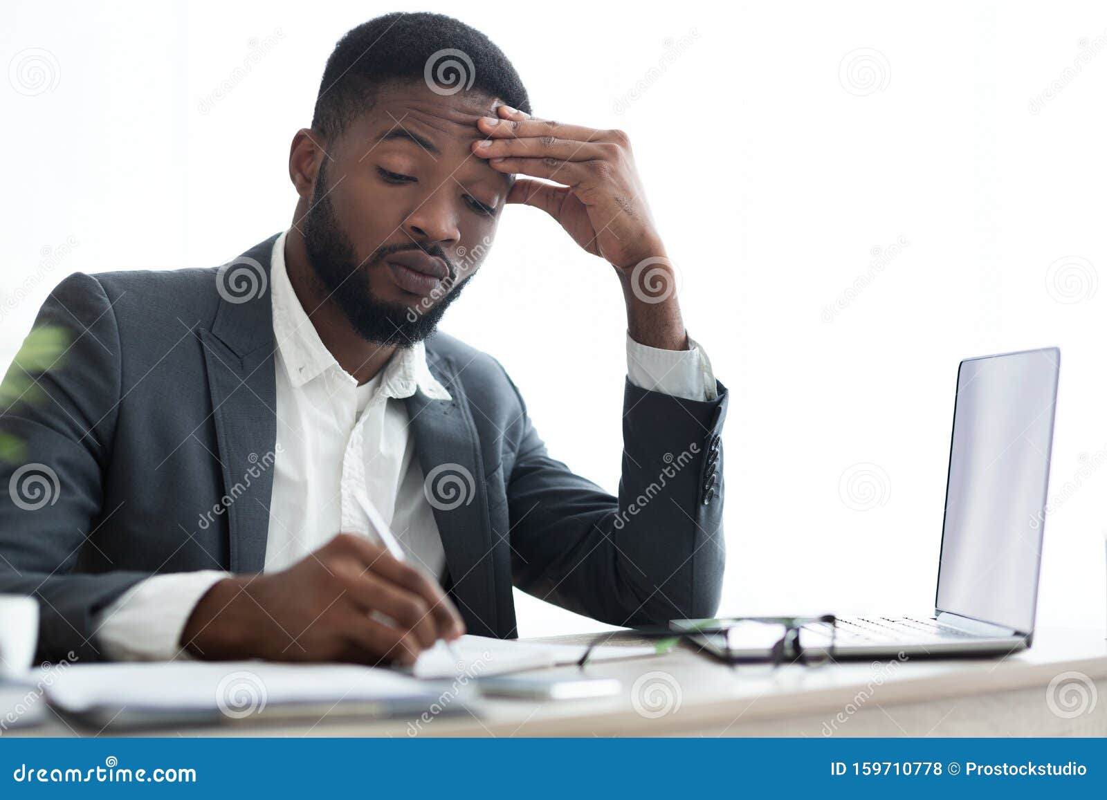 Focused Employee Taking Notes in Notebook at Workplace in Office Stock ...