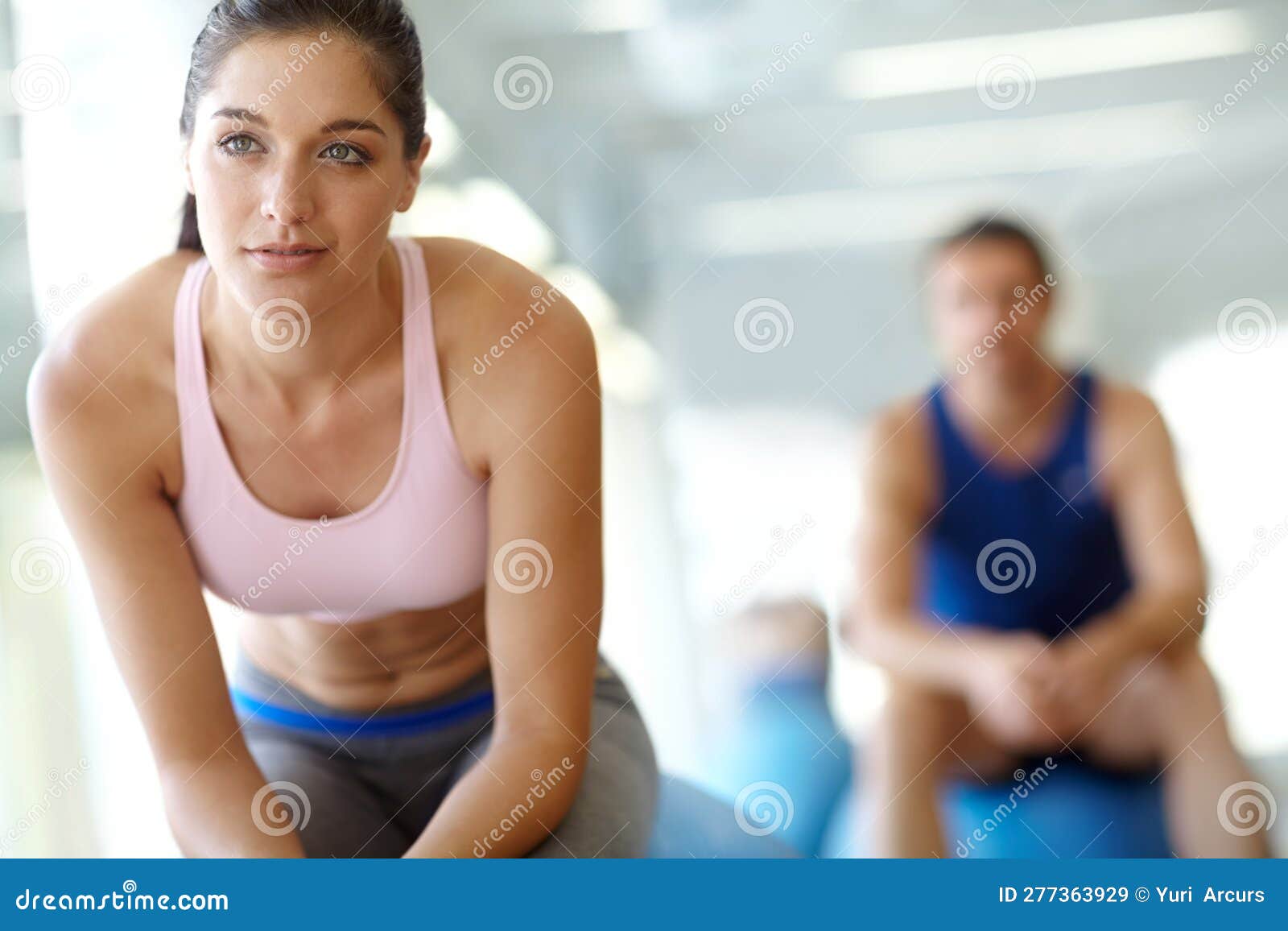 Focused on the Exercise Class. Two People Doing Exercises on Swiss ...