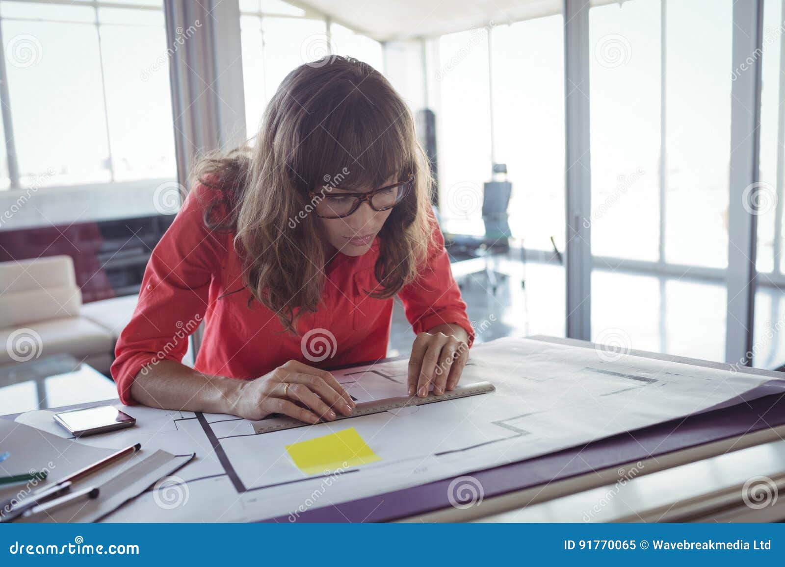 Focused Female Interior Designer Working in Office Stock Image - Image ...