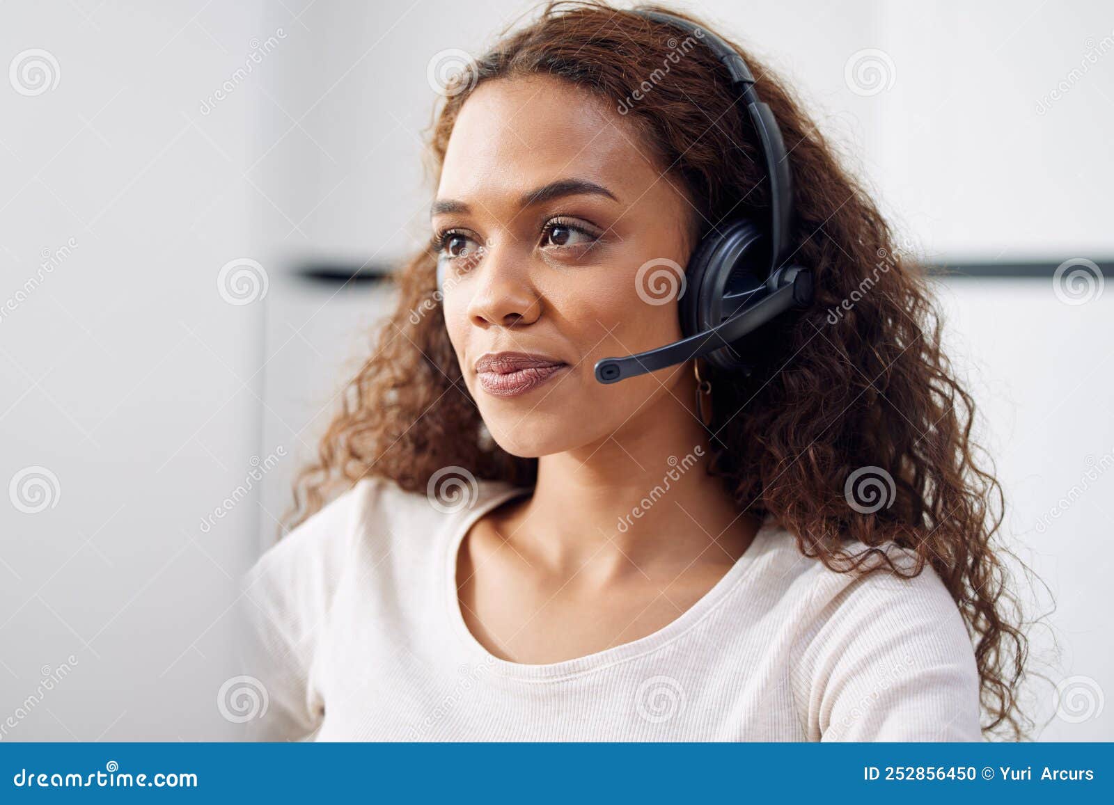 Focused on Finding a Solution. an Attractive Young Female Call Center ...
